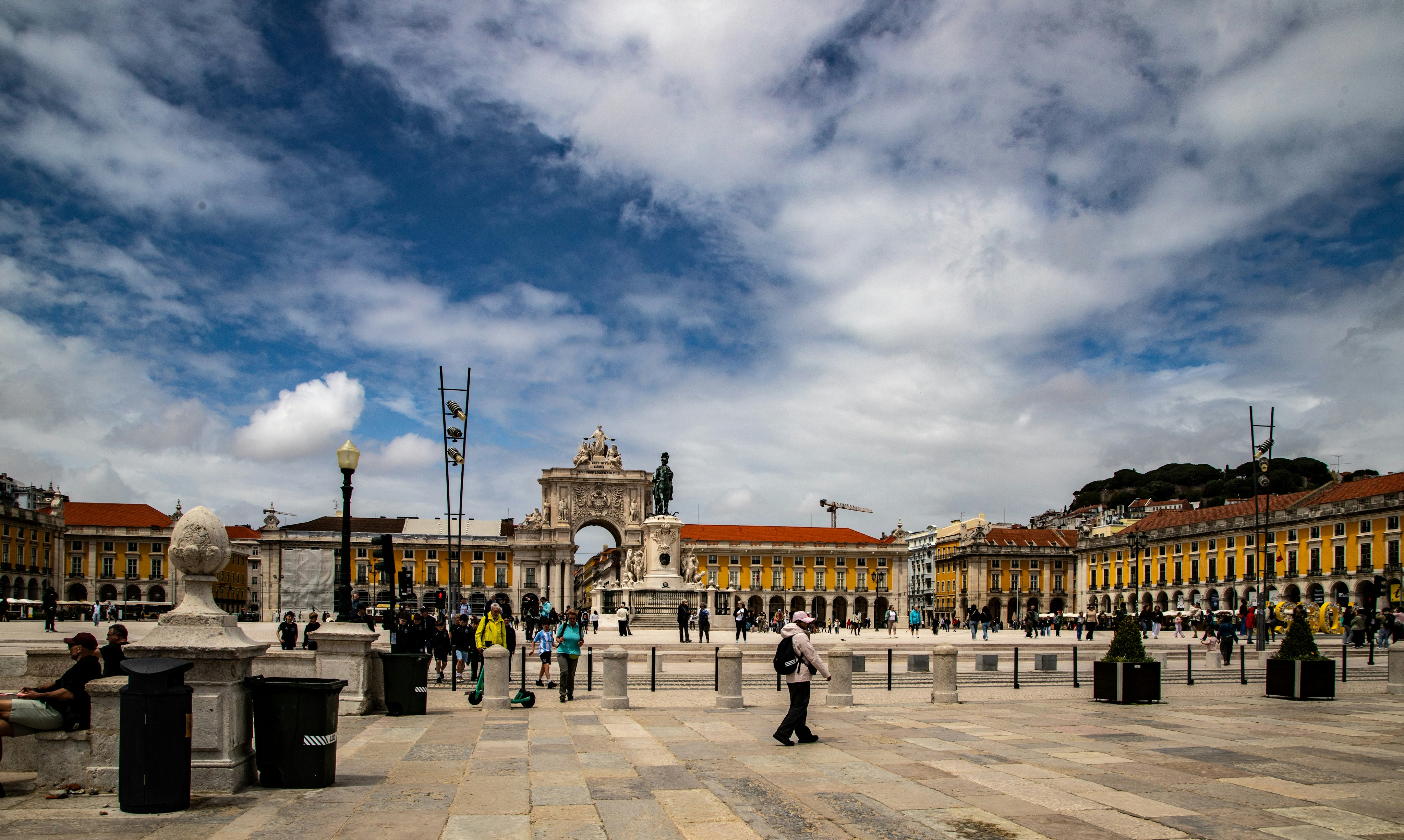 Arched Triumph: A sunlit Praça do Comércio Awakens