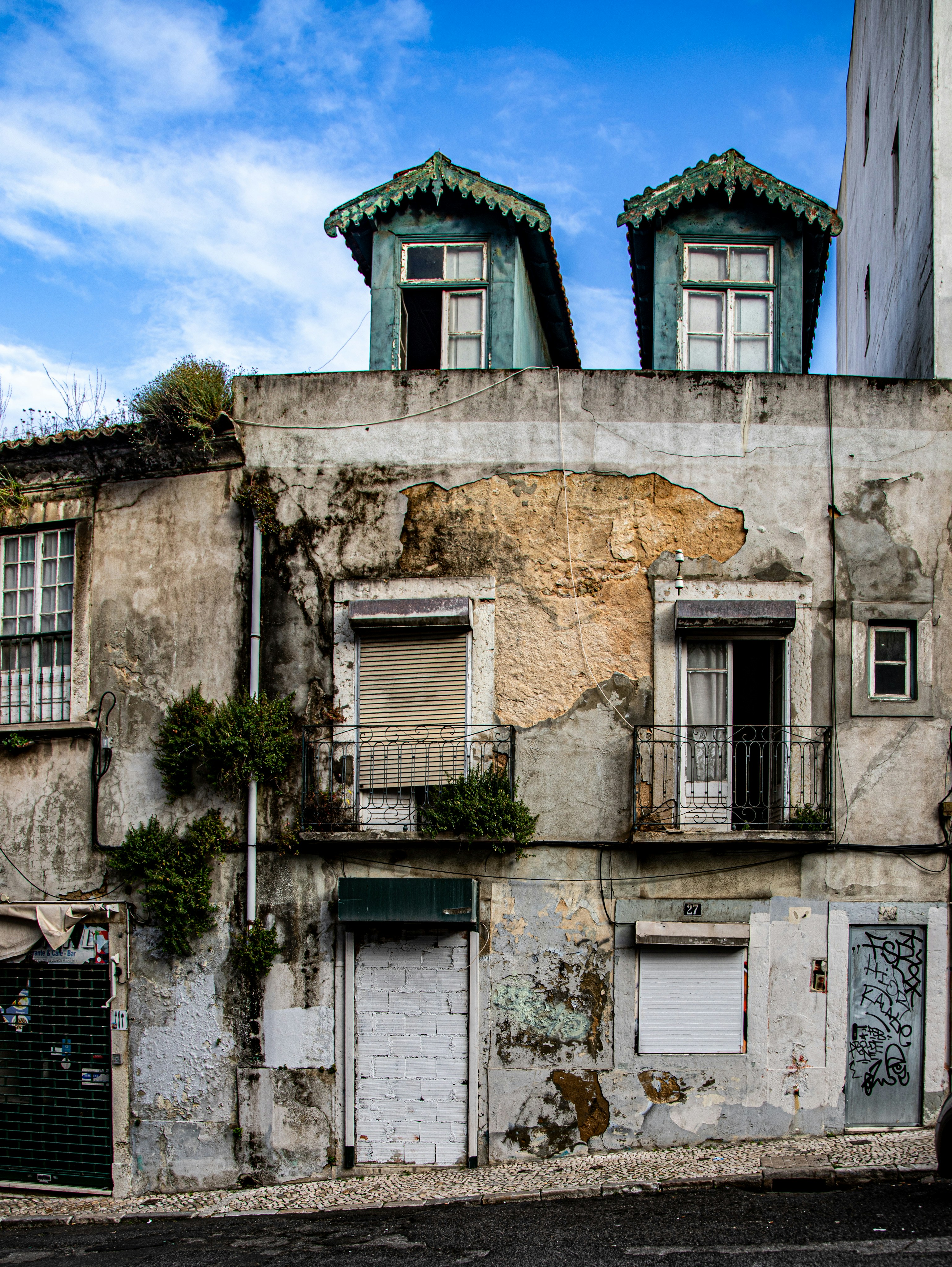 Weathered Facade, Green Gabled Windows