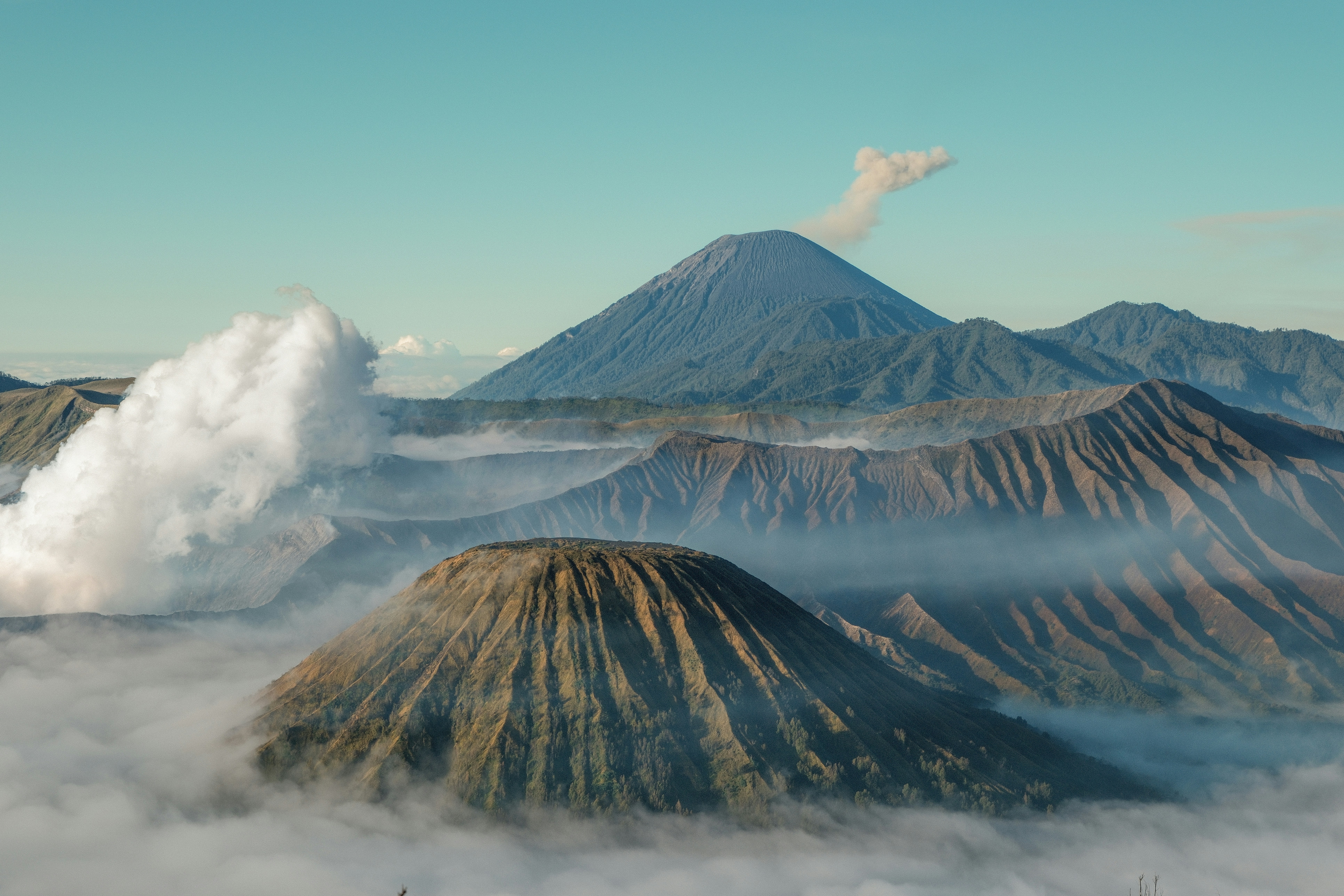 Mist-Crowned Cone: A Dawn View Over Stratified Volcanic Ridges