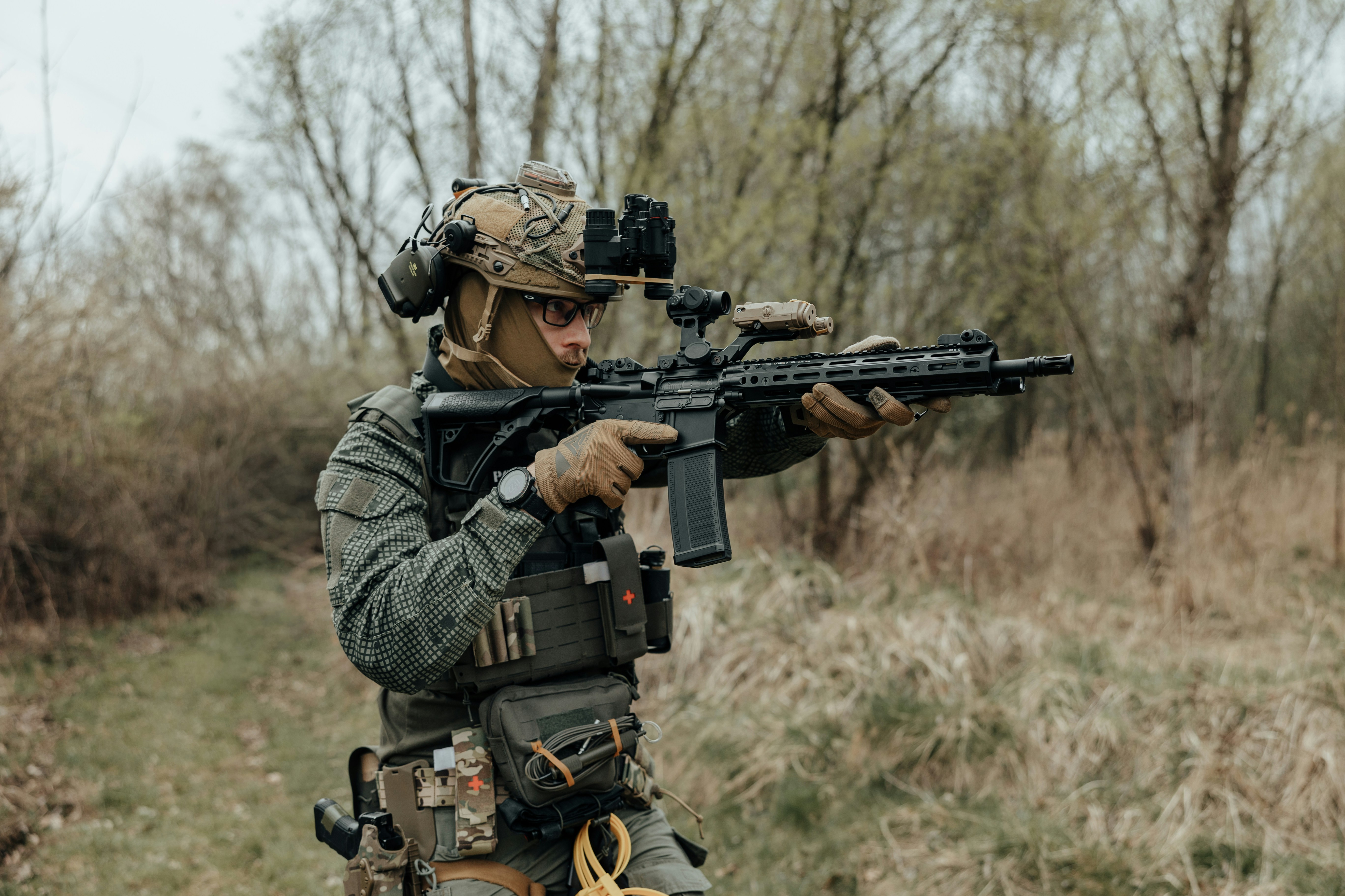 Tactical Focus: Soldier with Precision Carbine in Brushland Gap