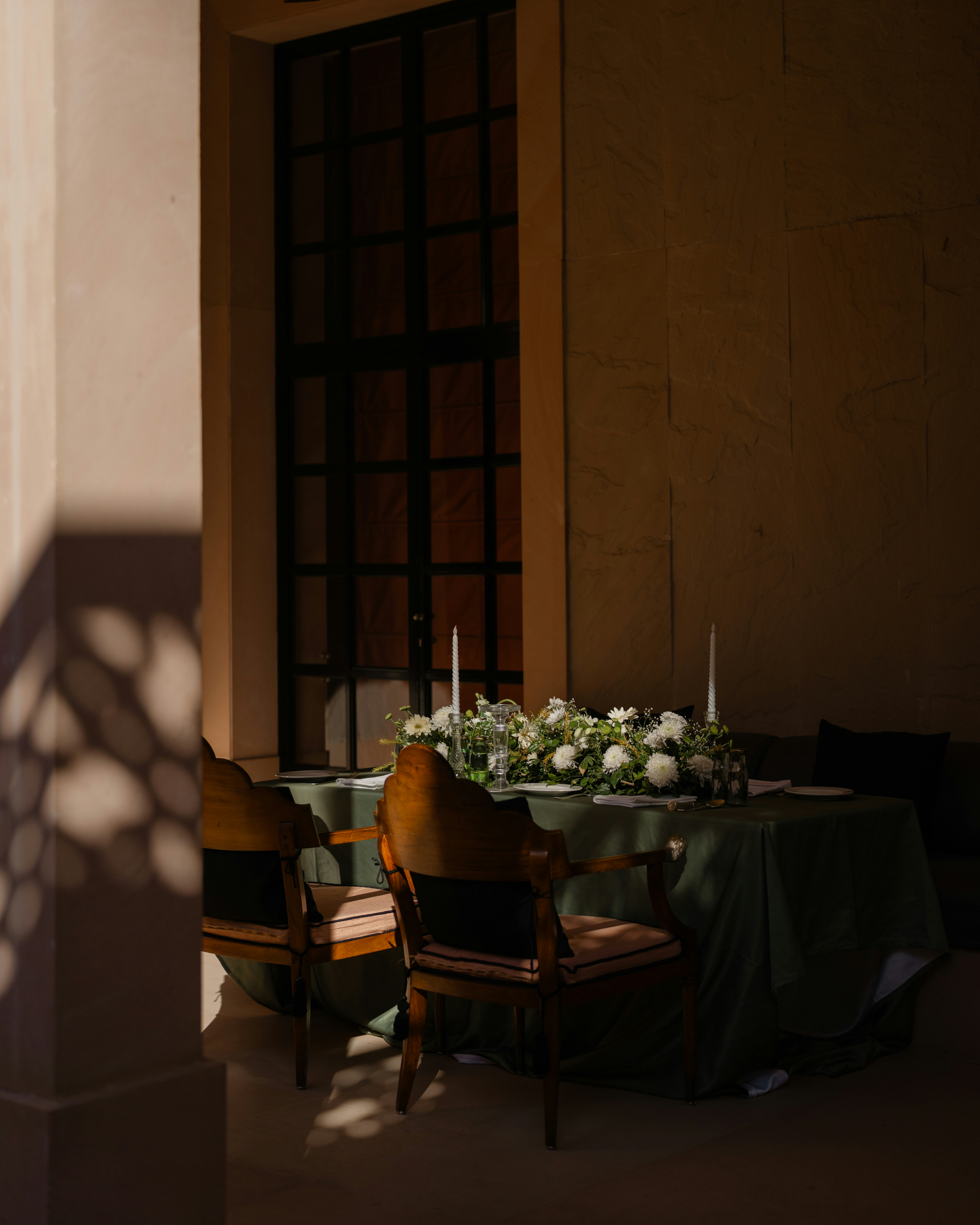 Sunlit Table for Two in Quiet Archway