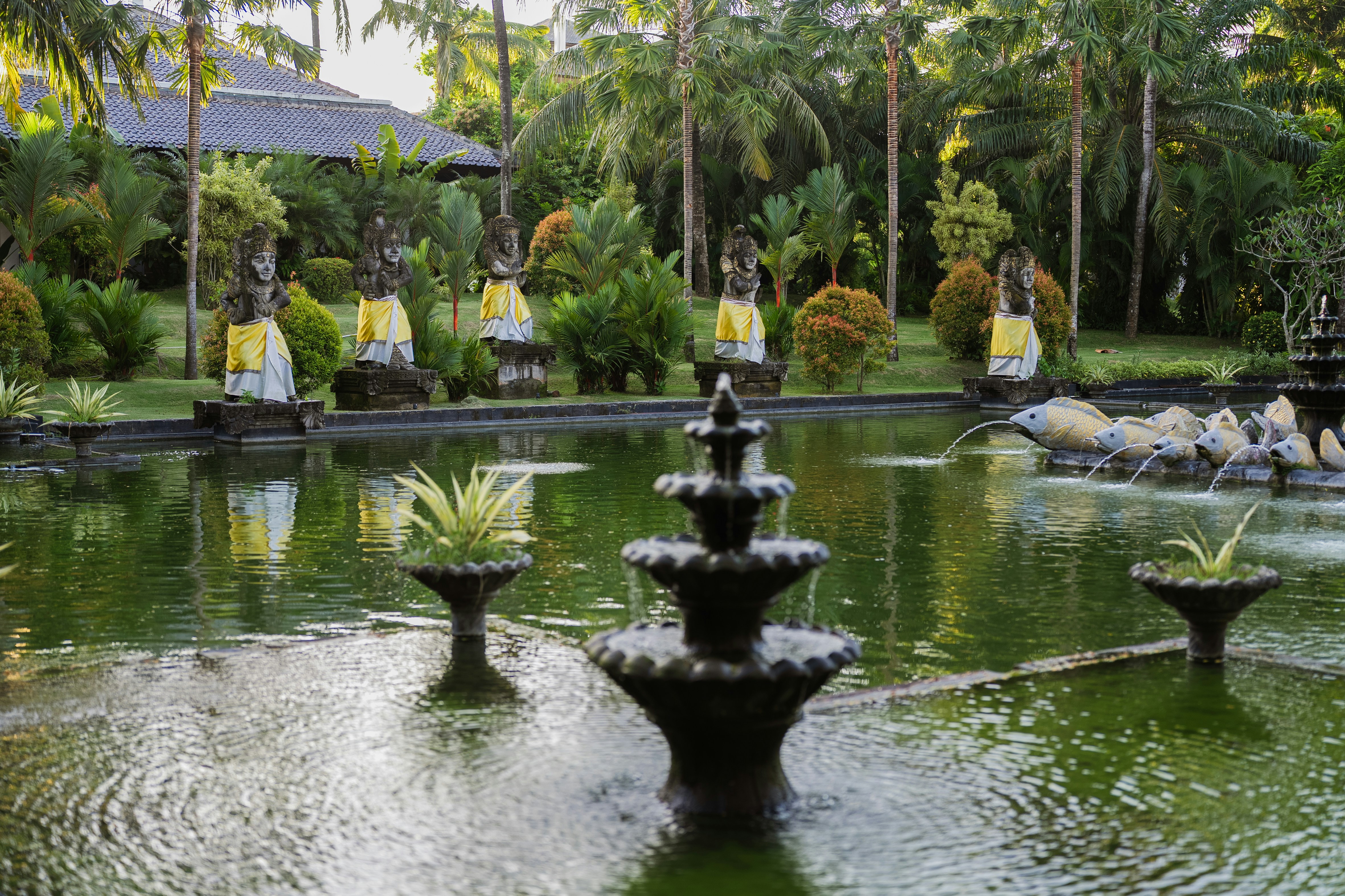 Floral Fountains and Lantern Statues by a Tranquil Pond