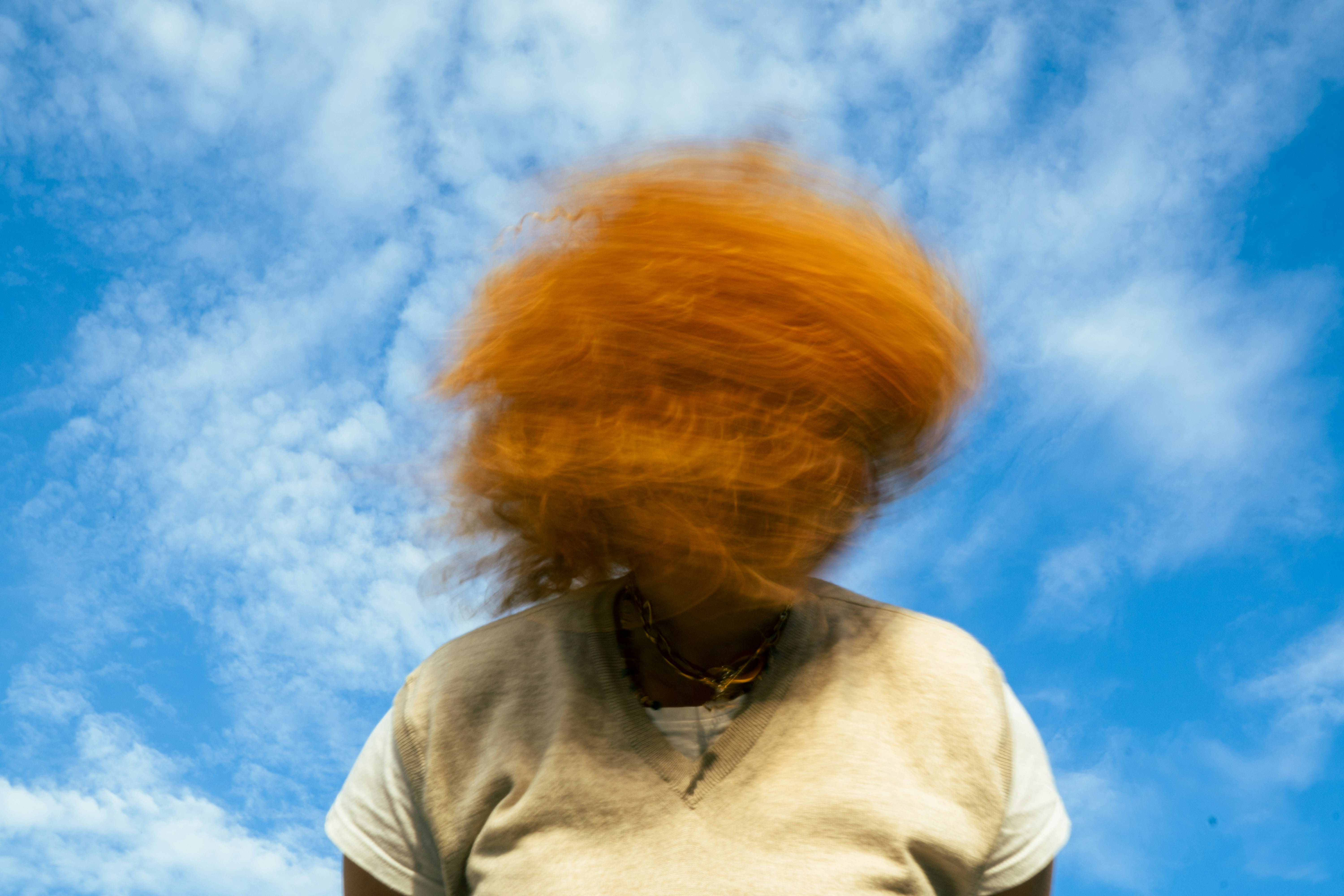 Blurry Blonde Motion Against a Clear Sky