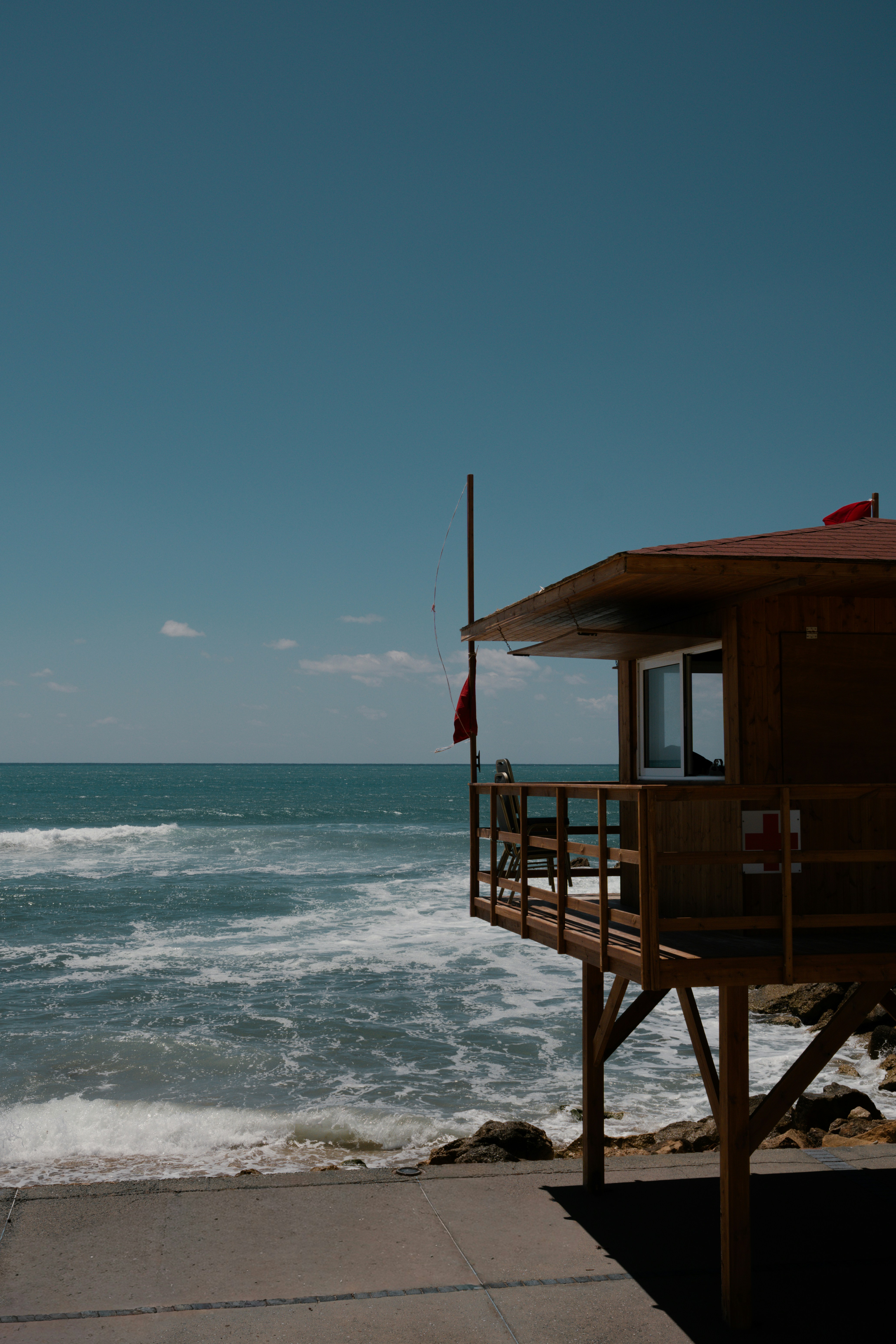 Seaside Lifeguard Post Perched Over Quiet Surf