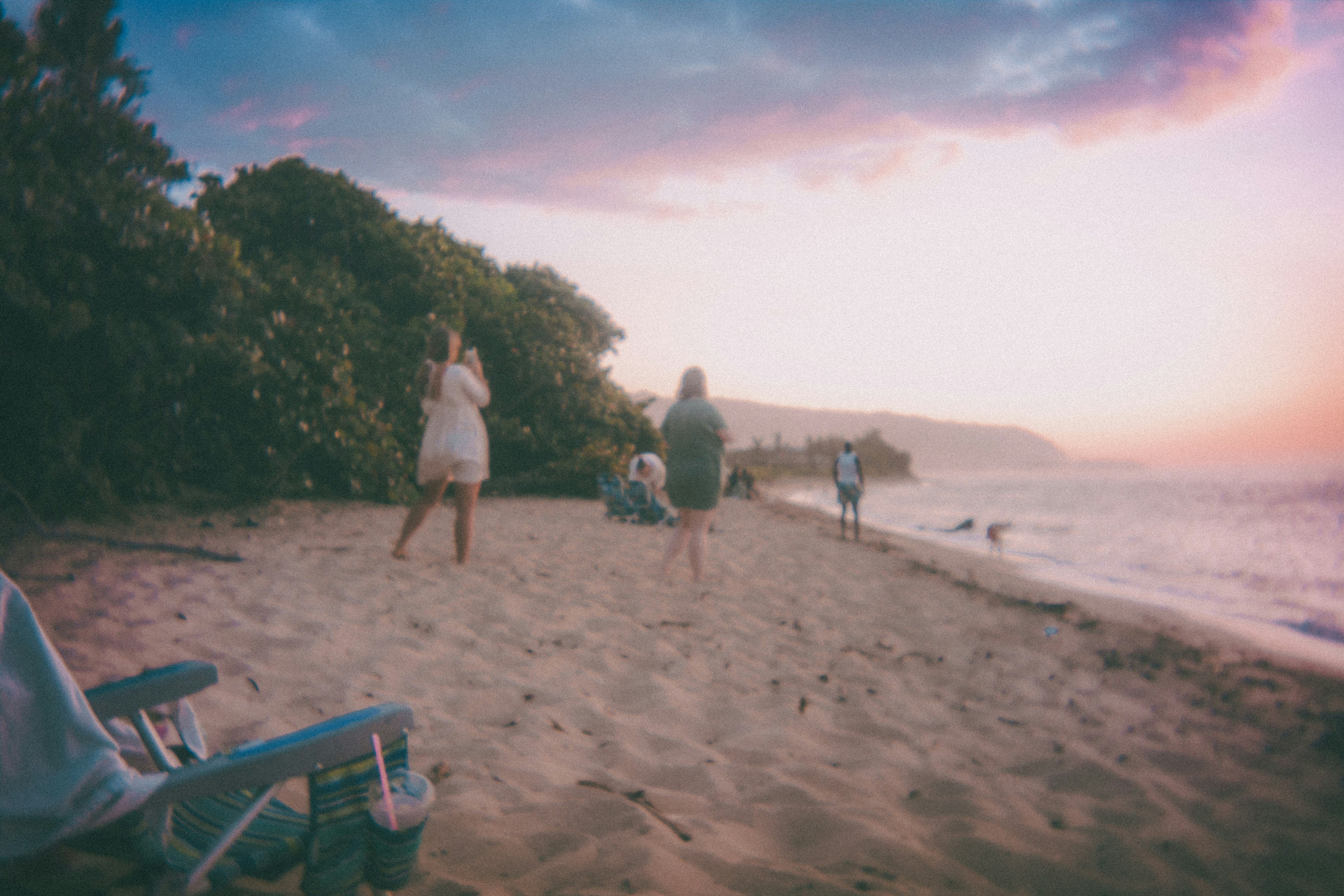 Dusk on the Quiet Beach: Figures in a Soft Blur