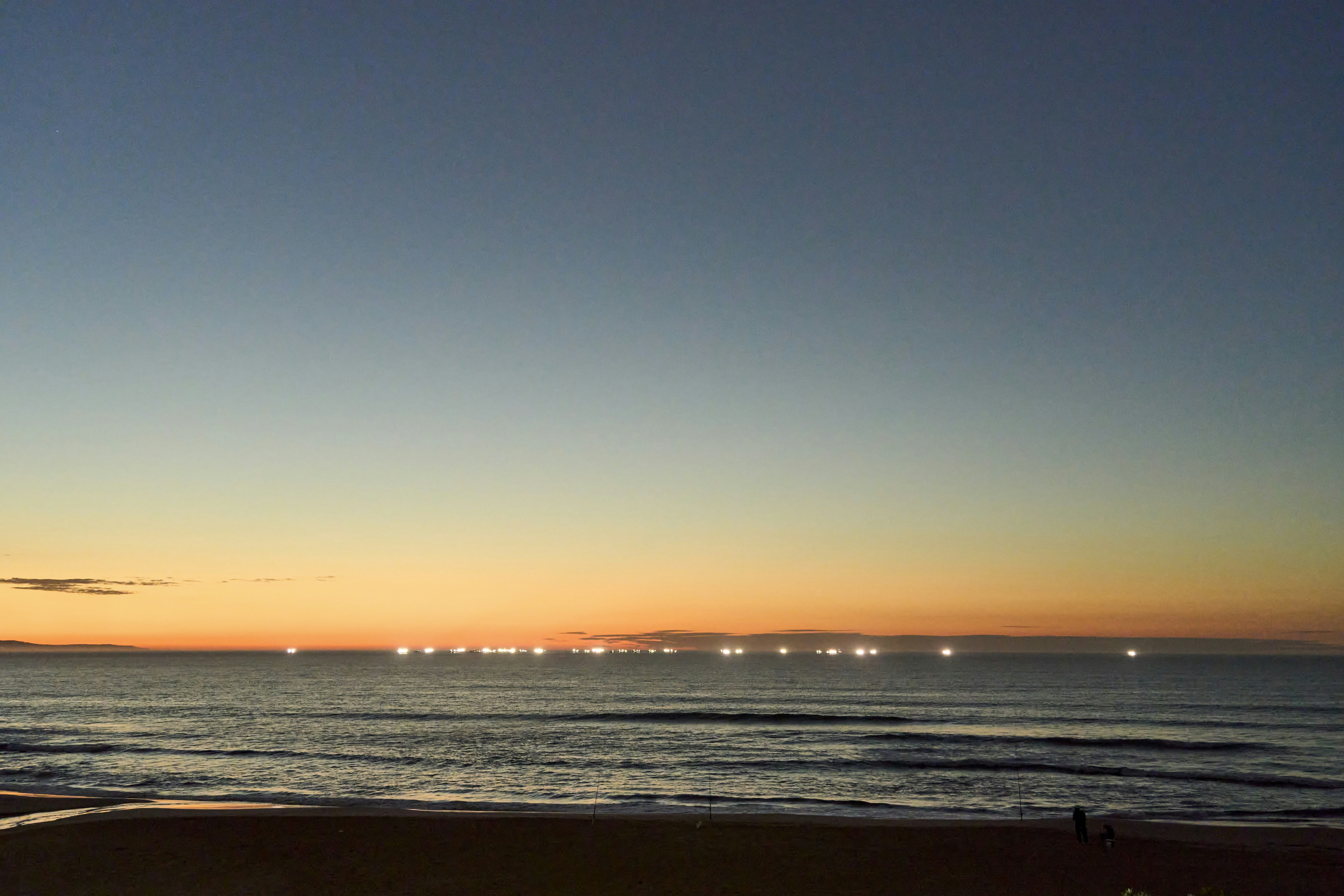 Dawn on the Quiet Tide: First Light over a Coastal Horizon