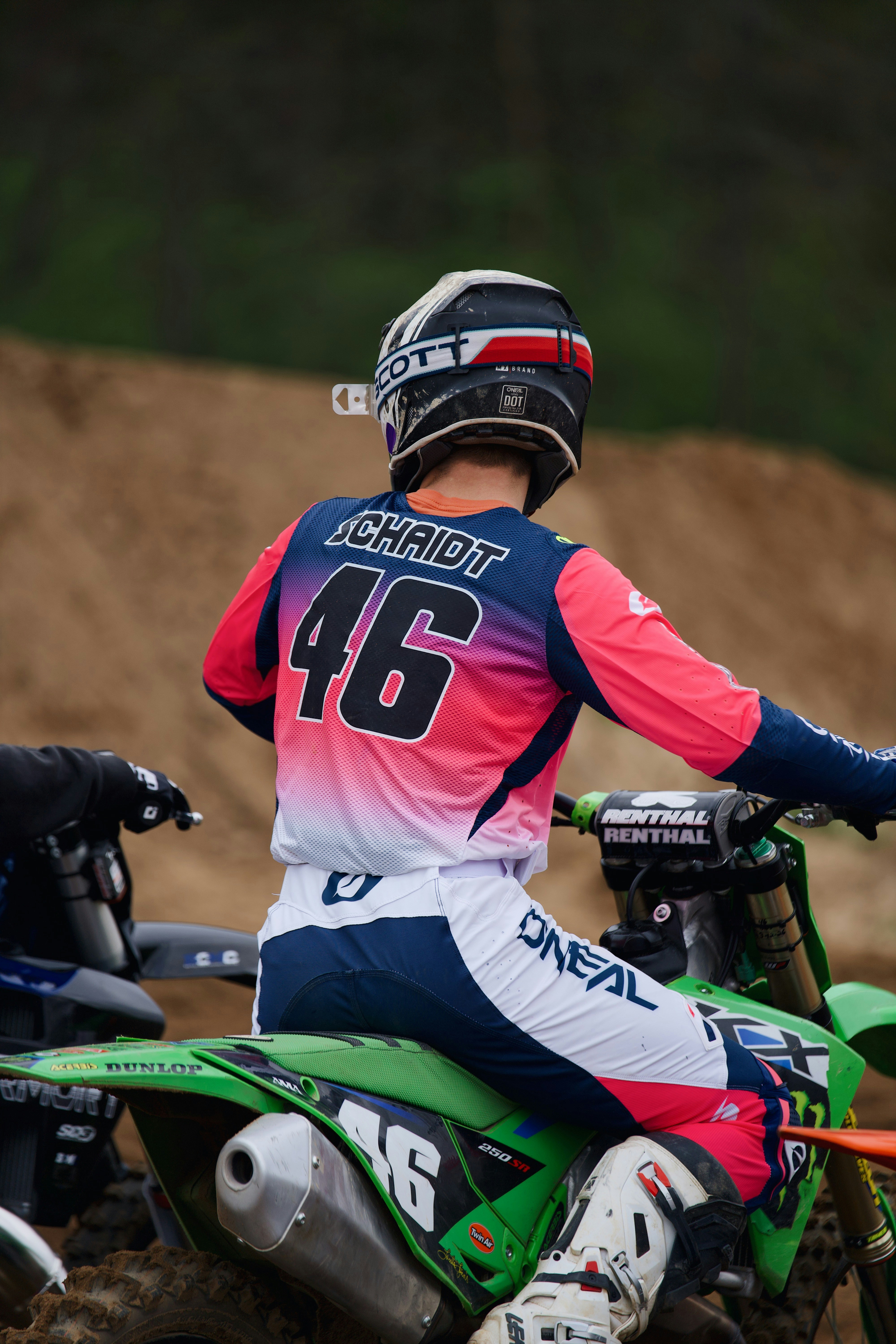 Rider 46: Focused on the Turn Amid the Dirt and Green