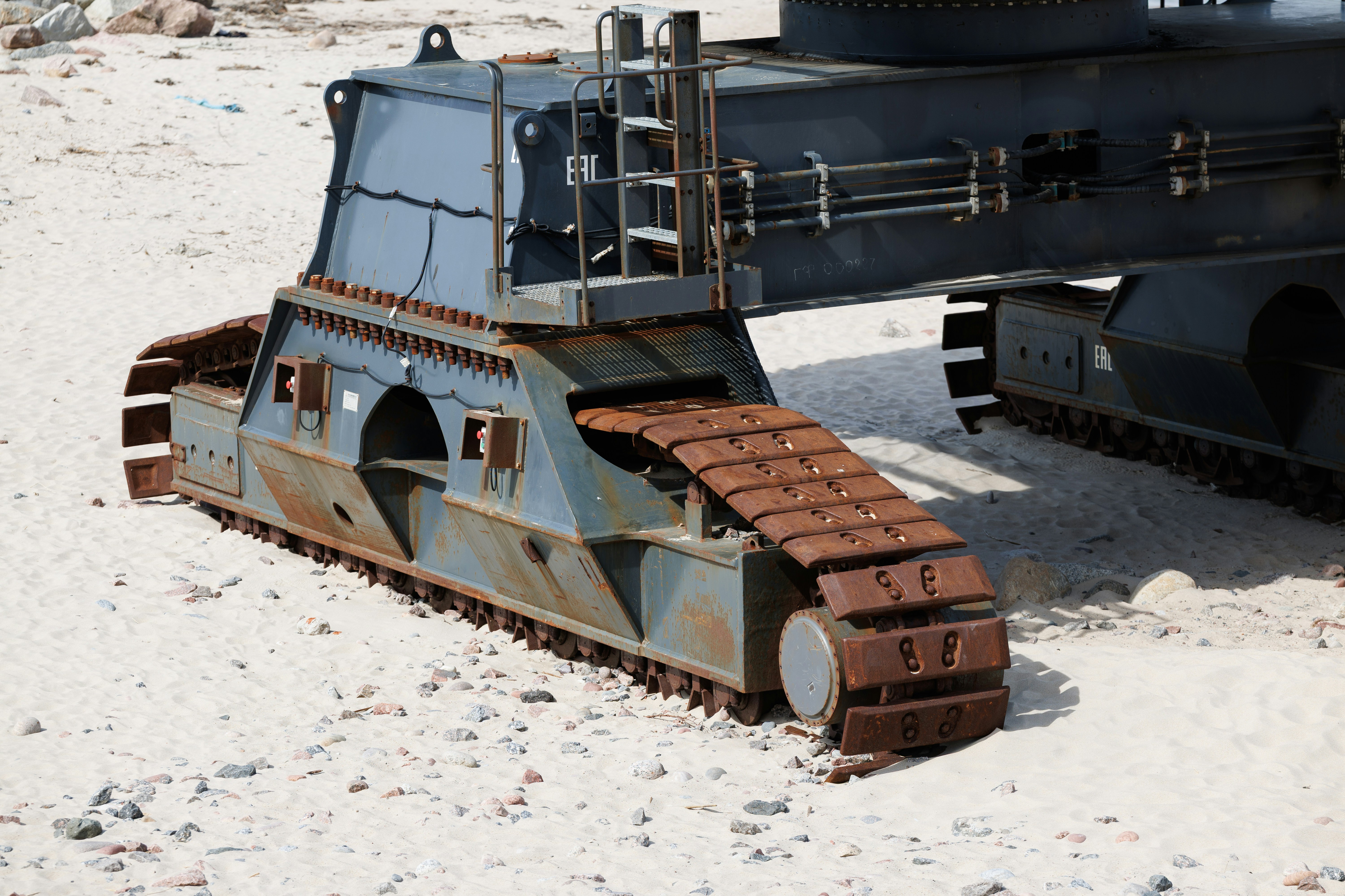 Iron Behemoth Resting on White Sand