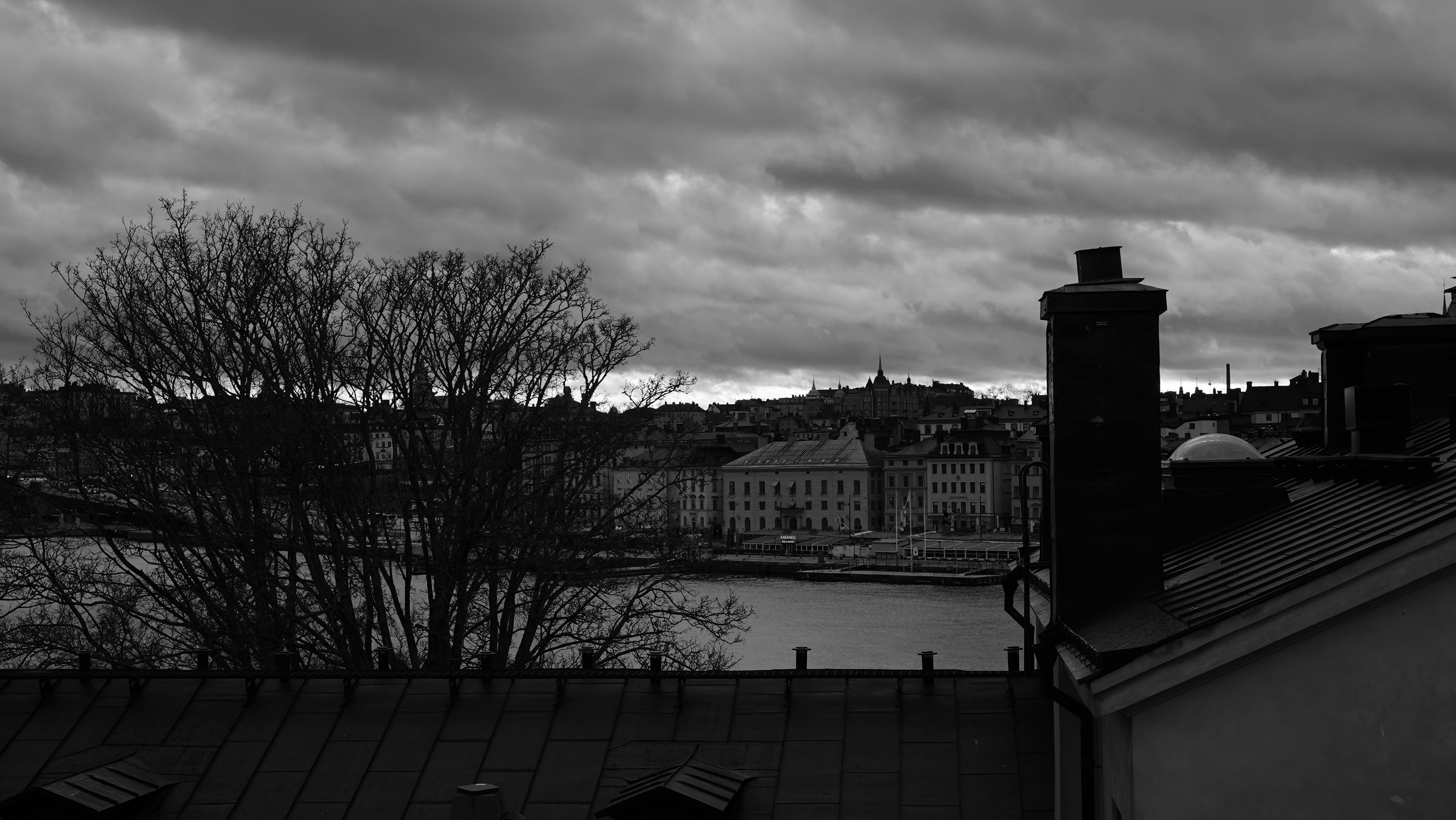 City Silhouette Over the River in Dusk Tones