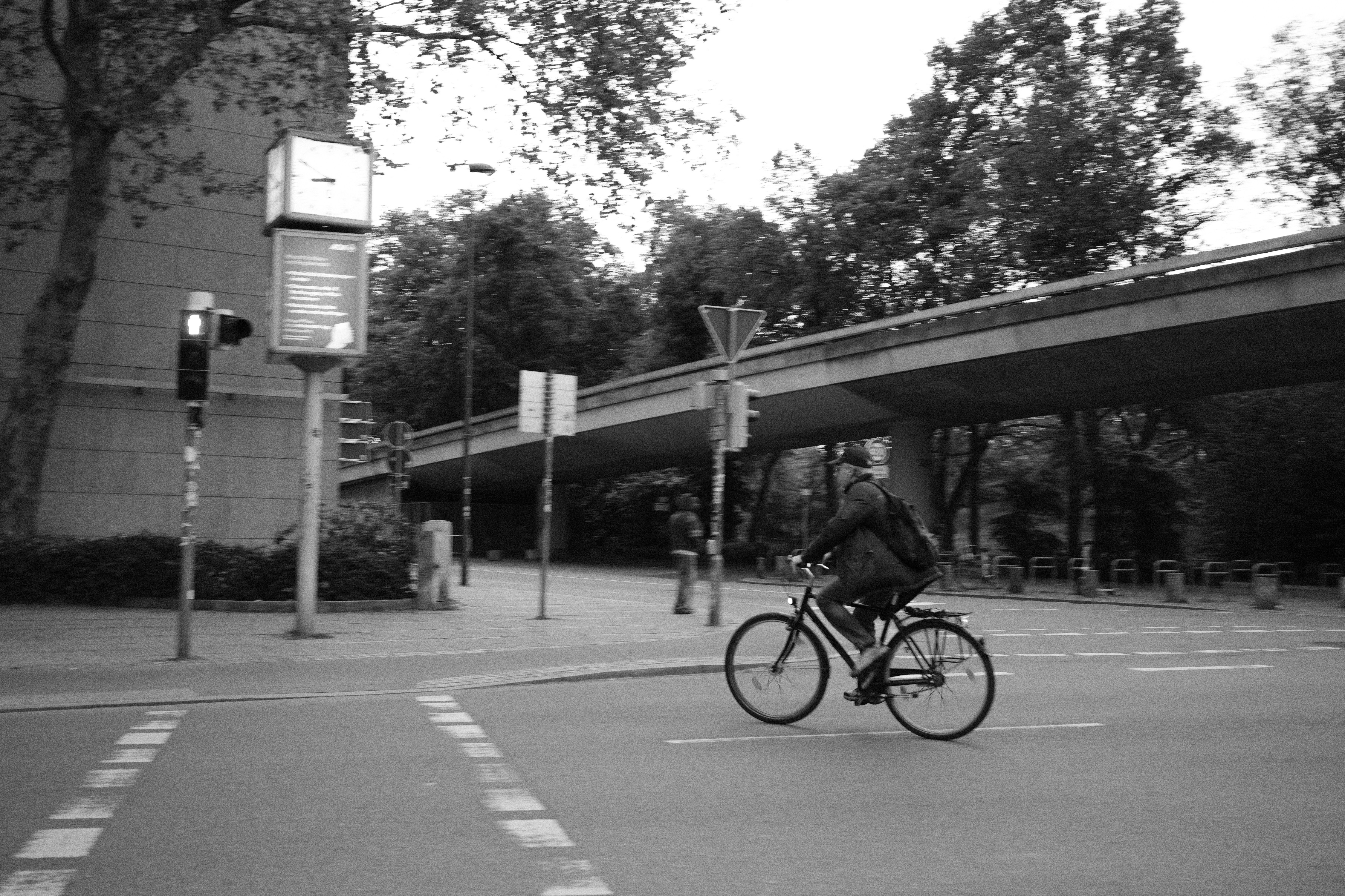 Cyclist Crossing Under the City Overpass