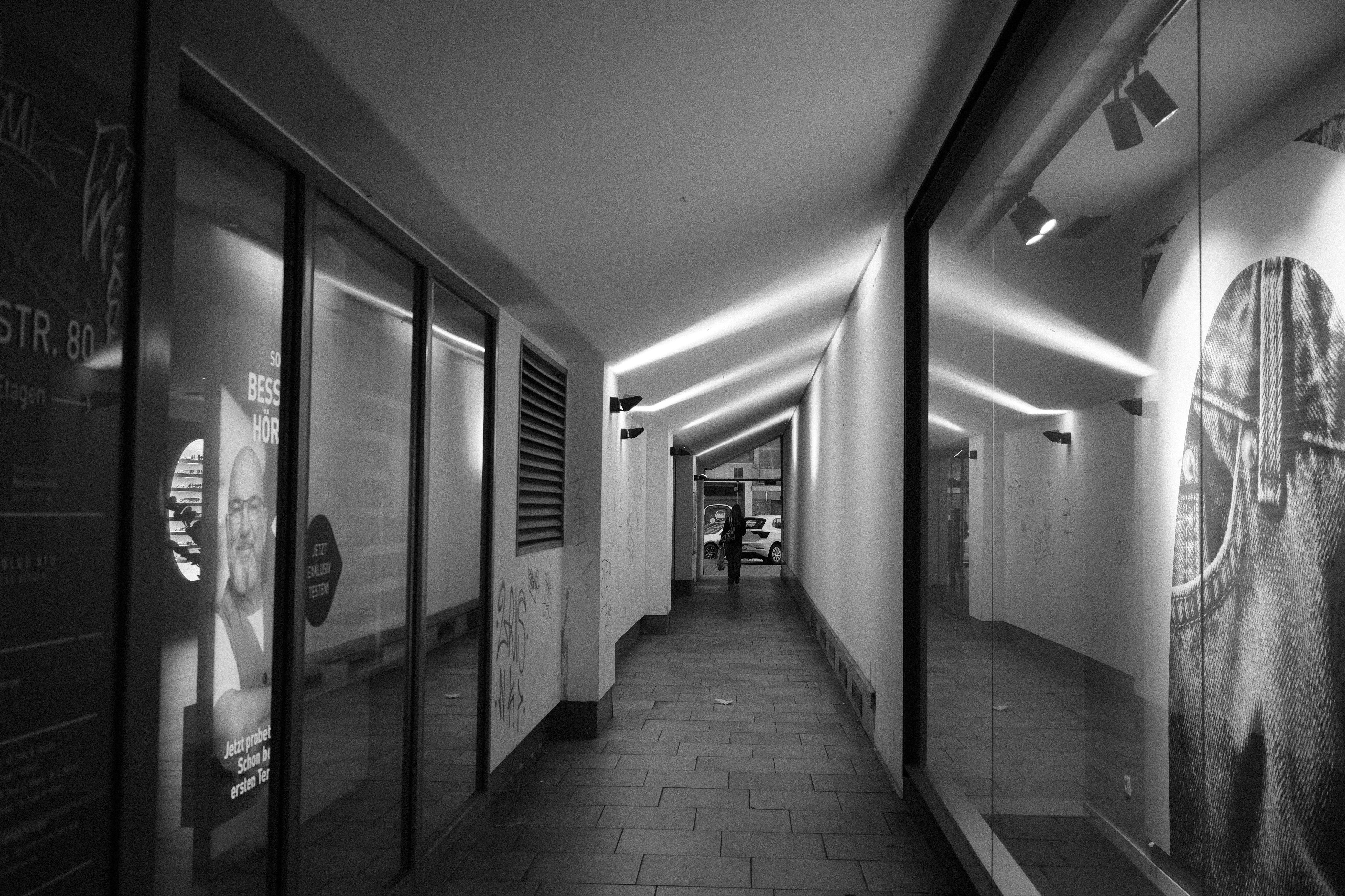 Quiet Corridor Between Glass and Stone
