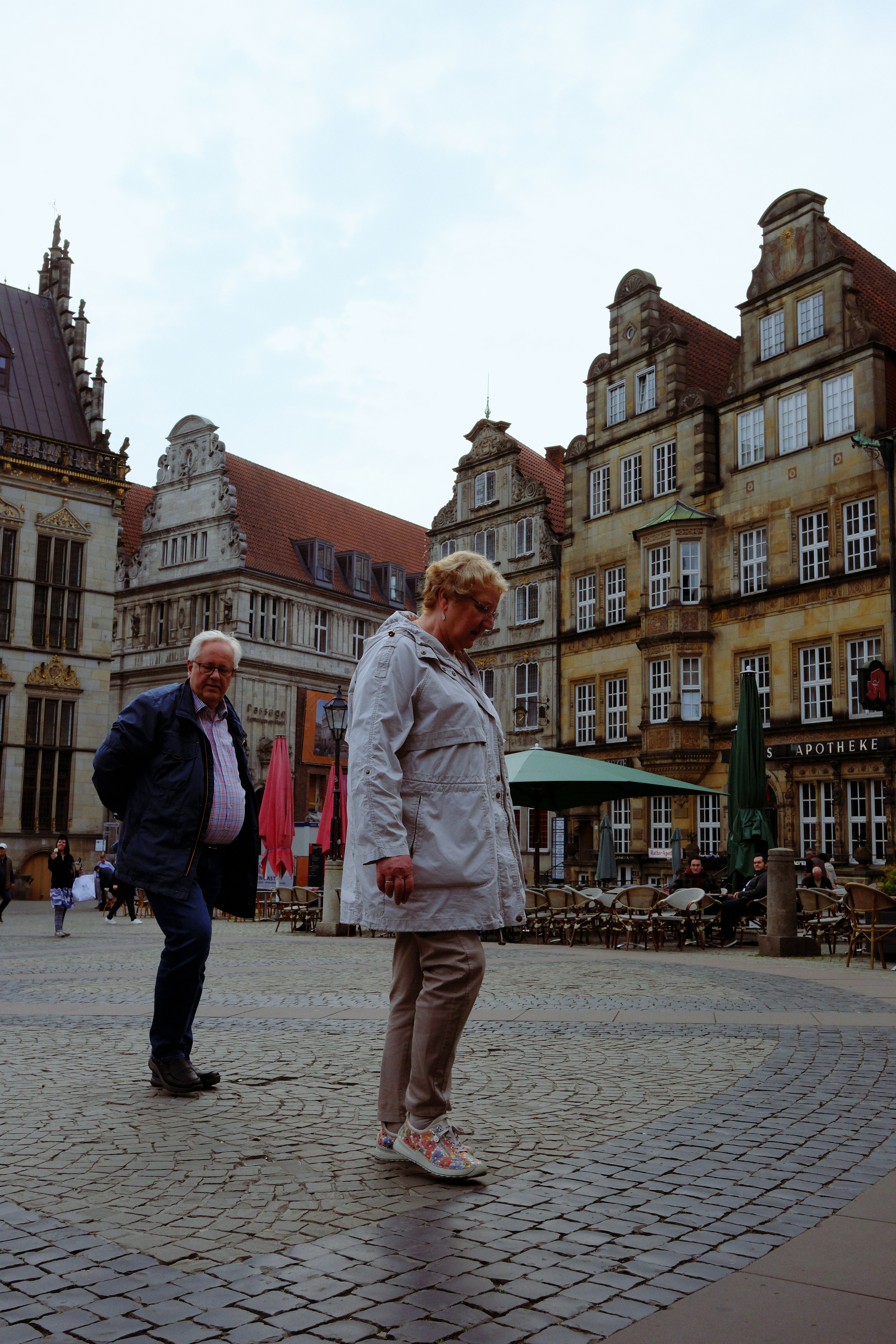 Cobbled Square Stroll: Neighbors in a Historic Town