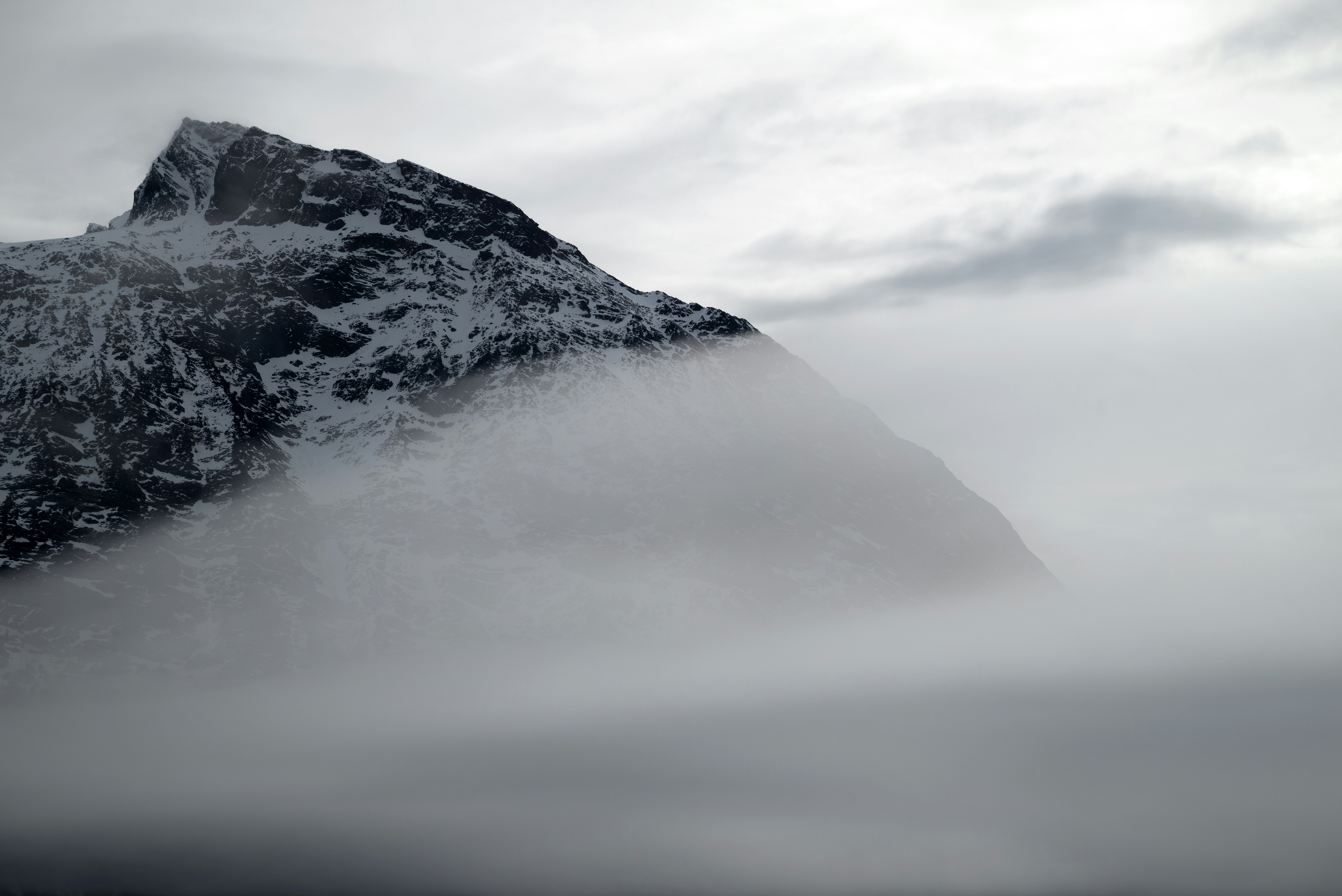 Mist-Wrapped Peak: A Solitary Highland Silhouette