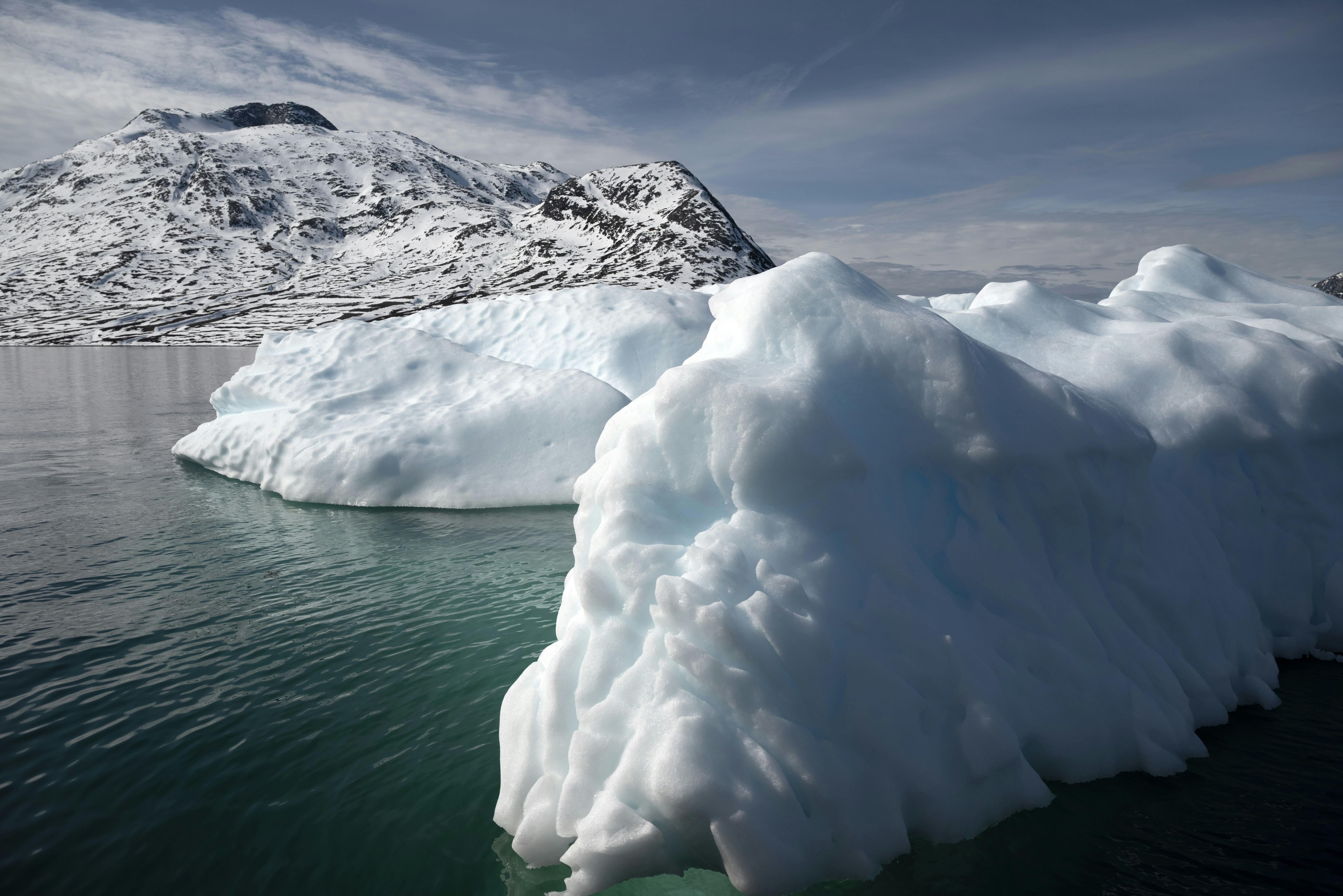 Icebound Prominence: The Iceberg Frontal Dominates a Serene Polar Scene