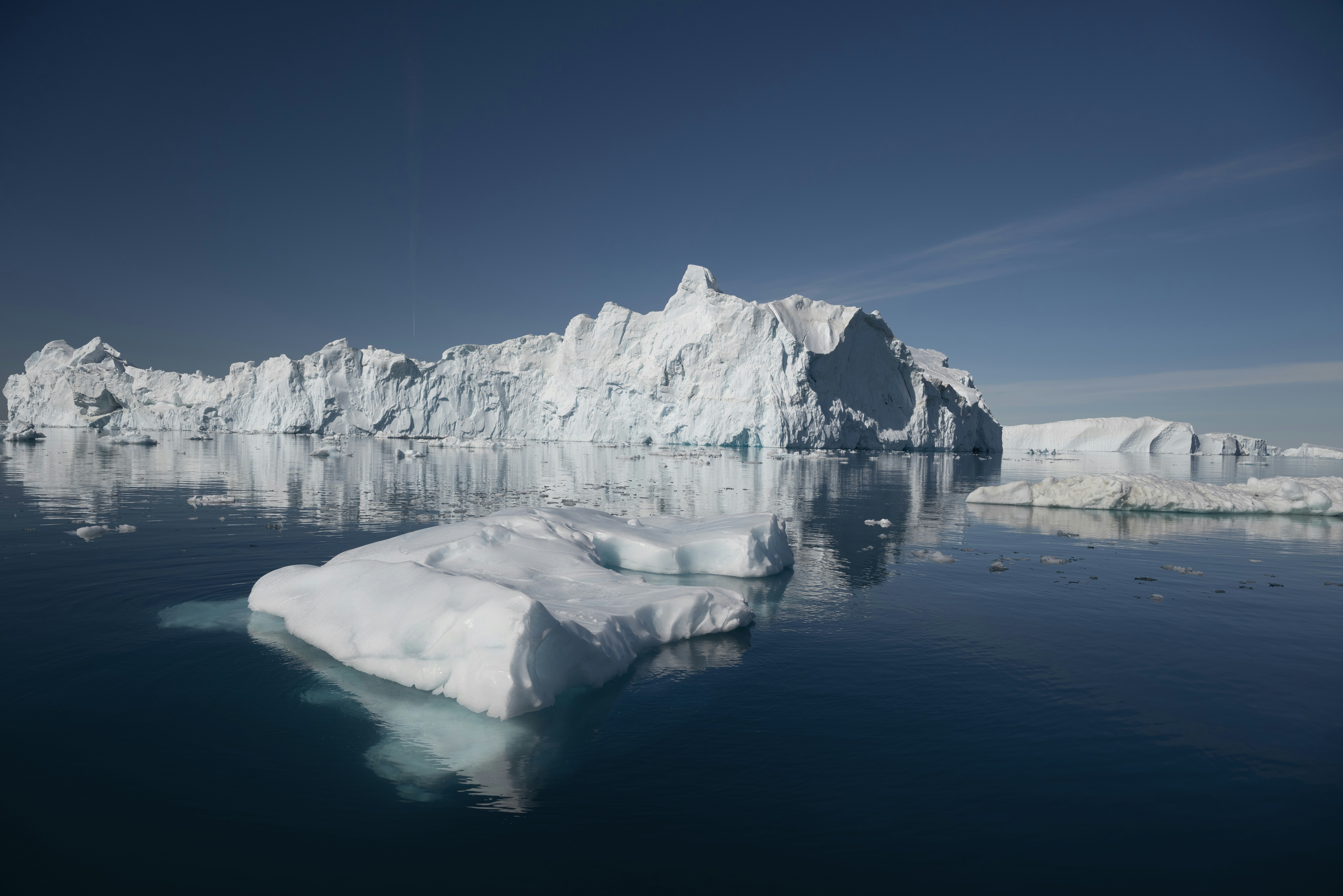 Midday Sentinel: Iceberg Crowned Against a Calm Polar Sea