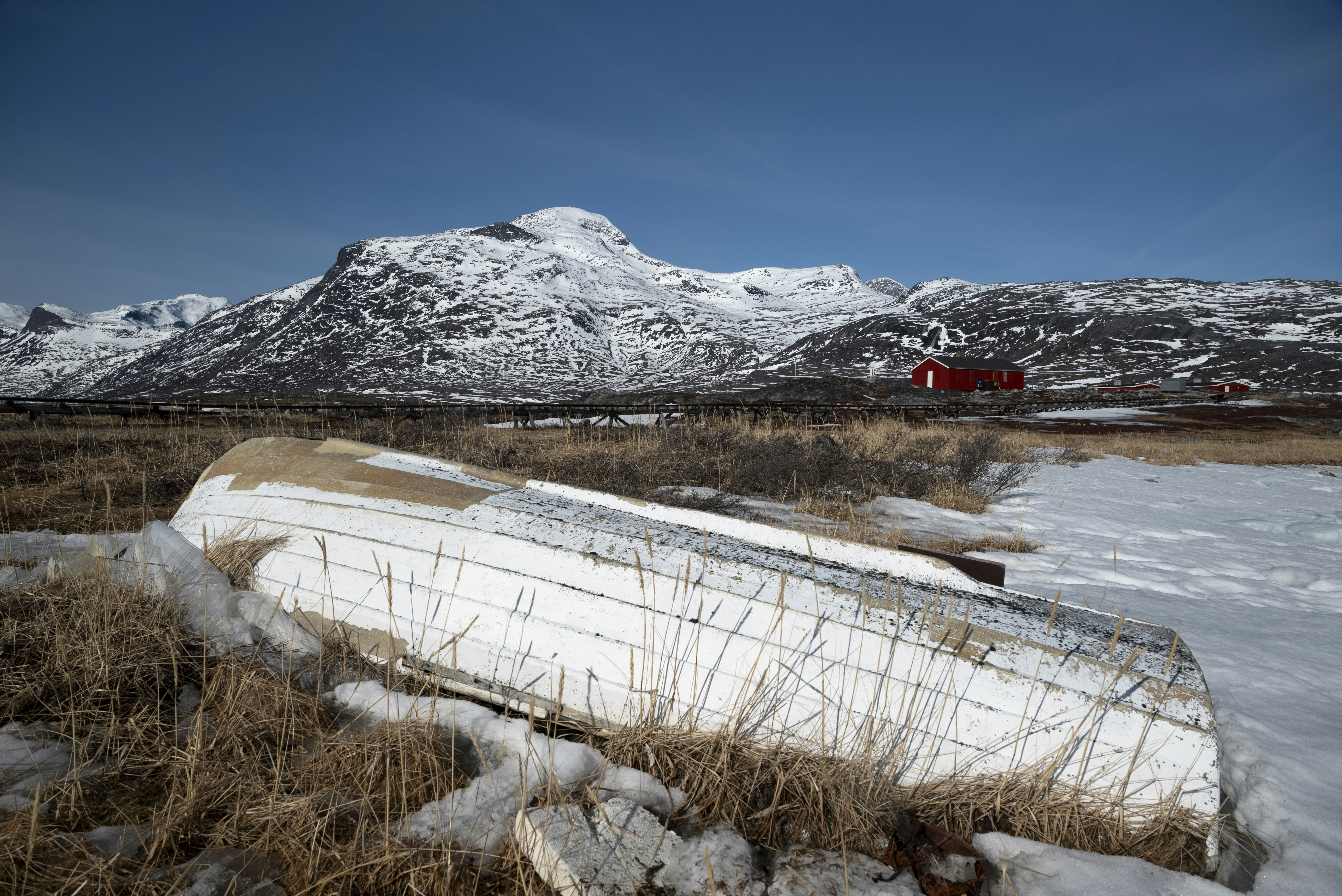 Snow-Soft Boats and Red Barn Under Alpine Light