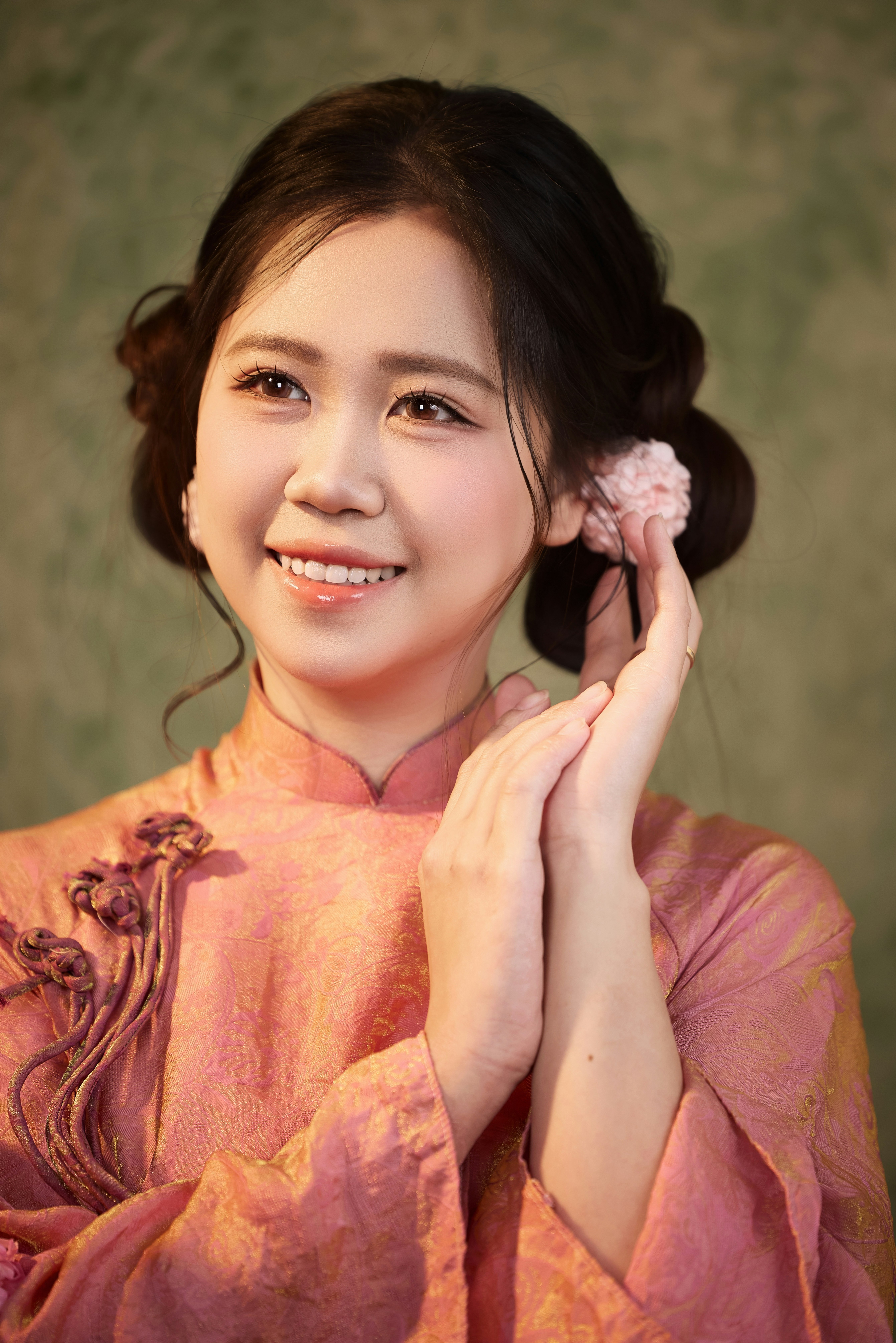 Soft Light, Bright Smile: Portrait of a Cheerful Moment in Pink