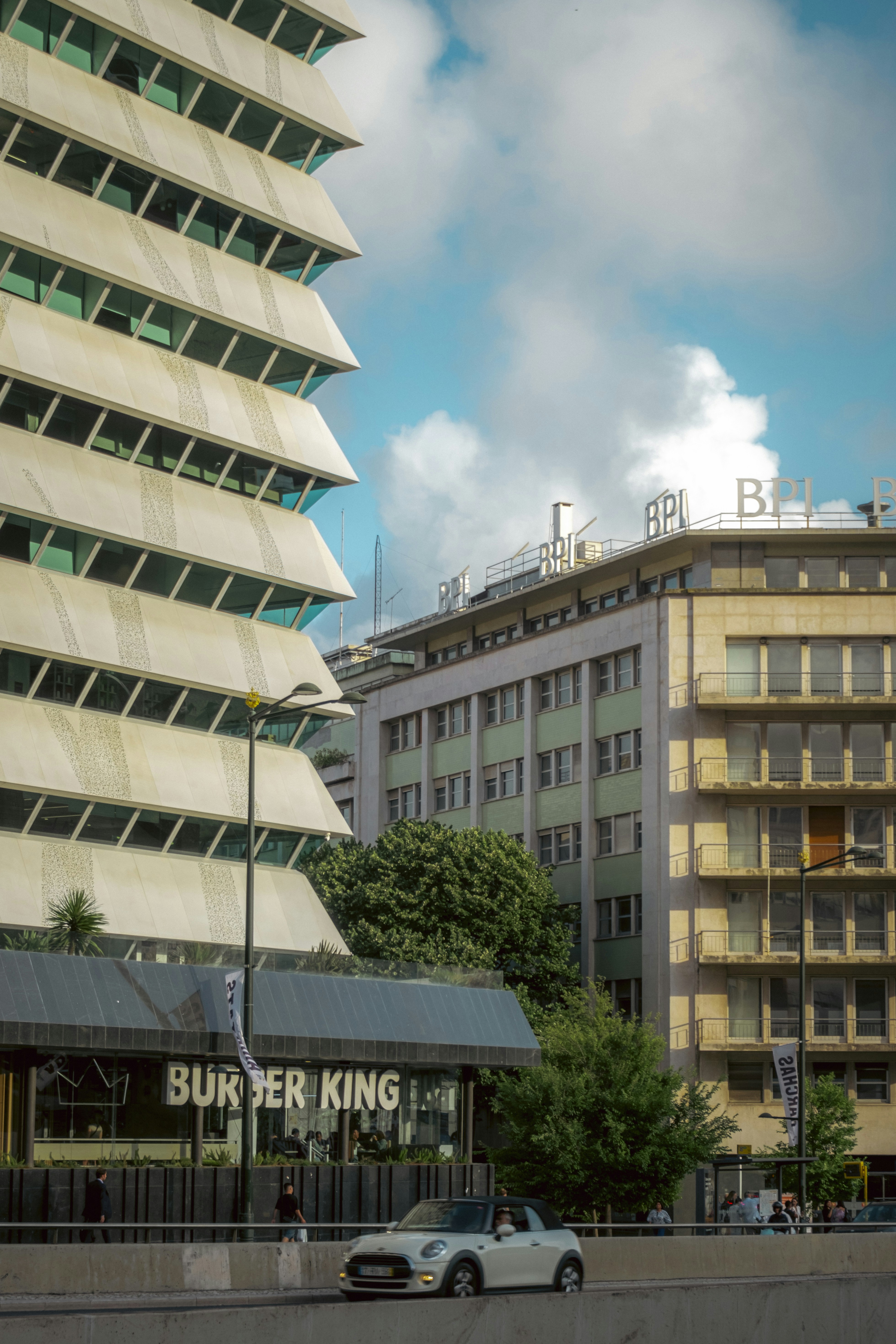 Urban Pillars and Burger King: A Tale of Facades Under Sky