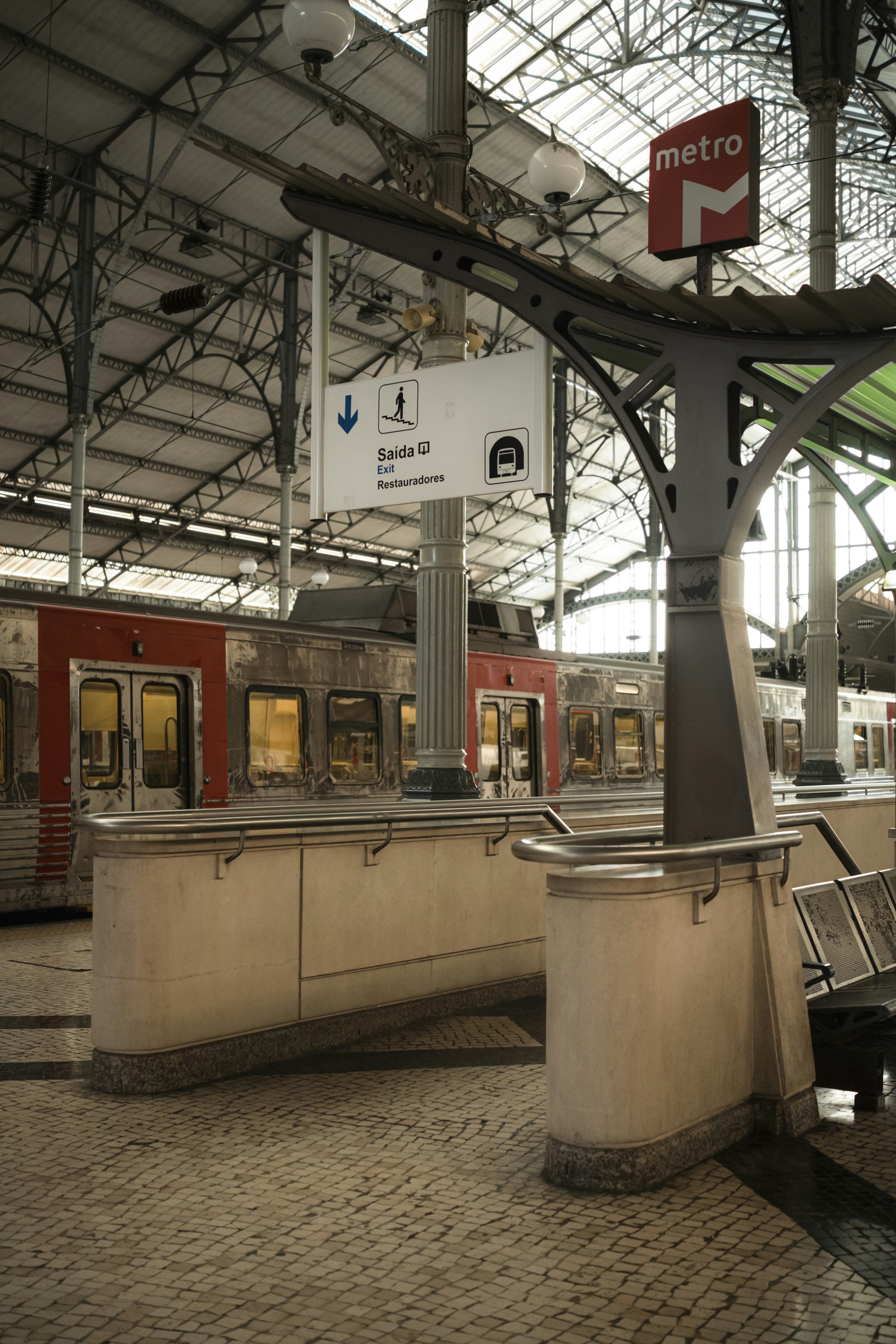 Metro Platform Portrait: A Quiet Moment Under Industrial Arches