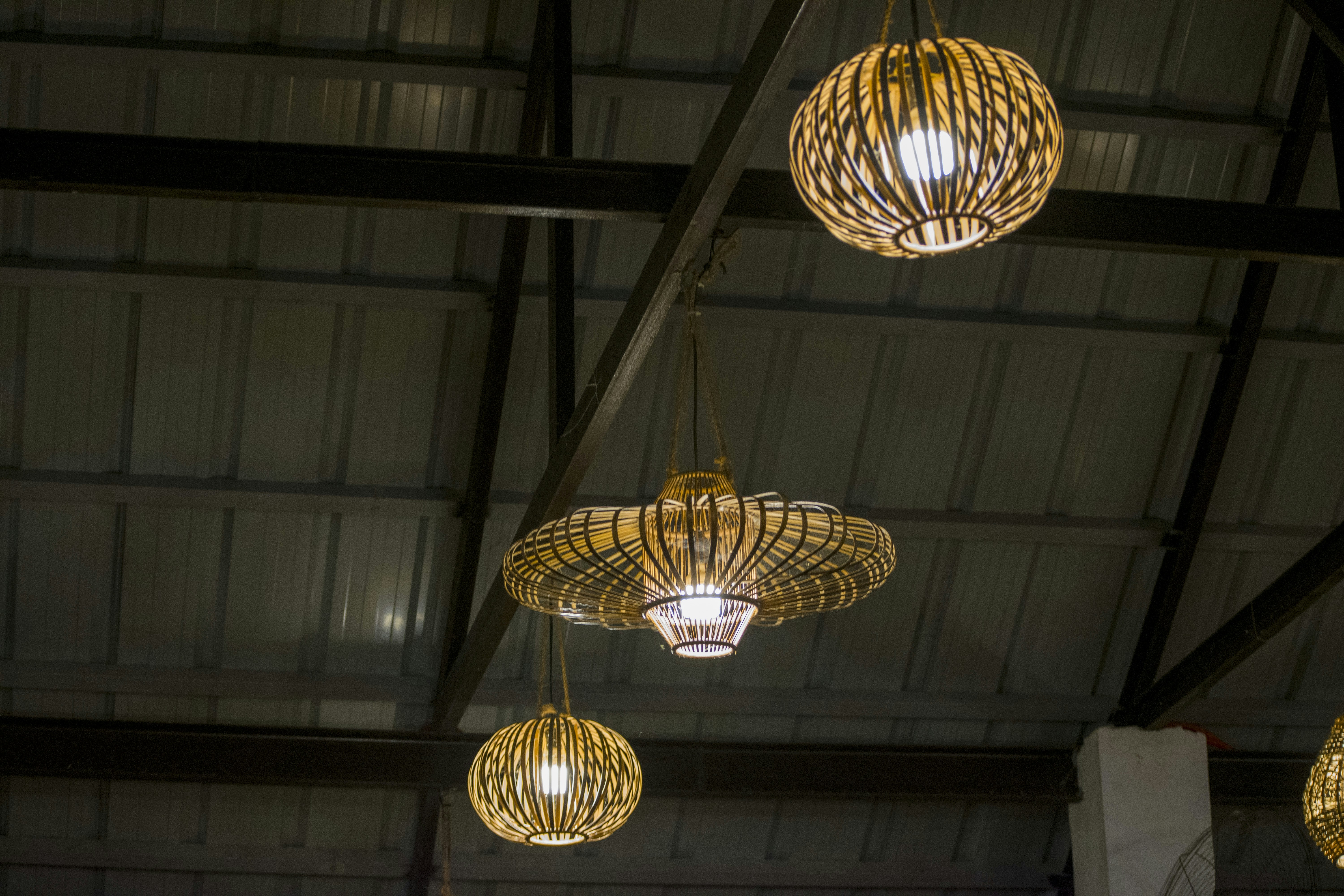 Lingering Glow Above: Lanterns Hanging in a Rustic Ceiling