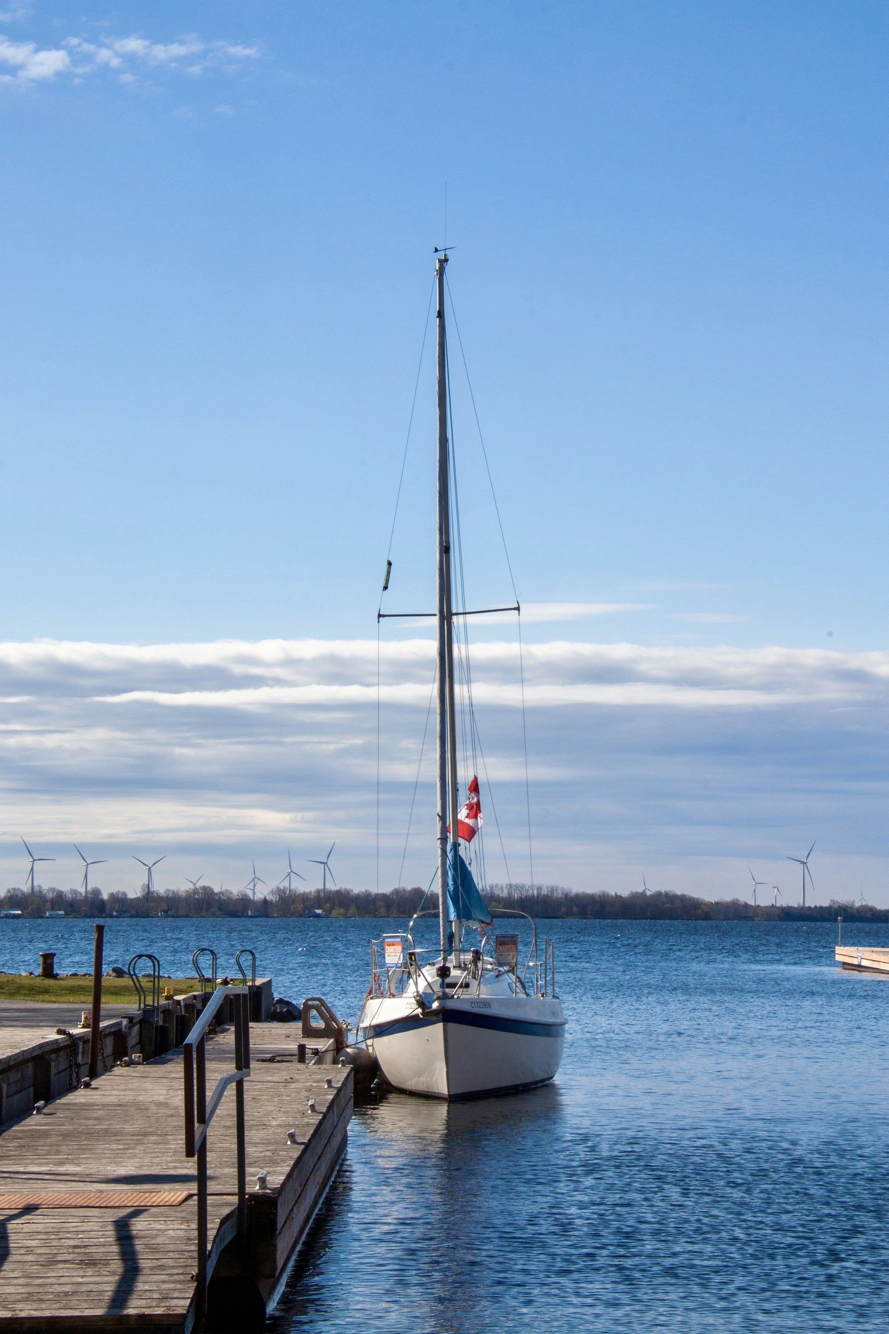Sailboat at the Pier Under a Bright Nordic Sky