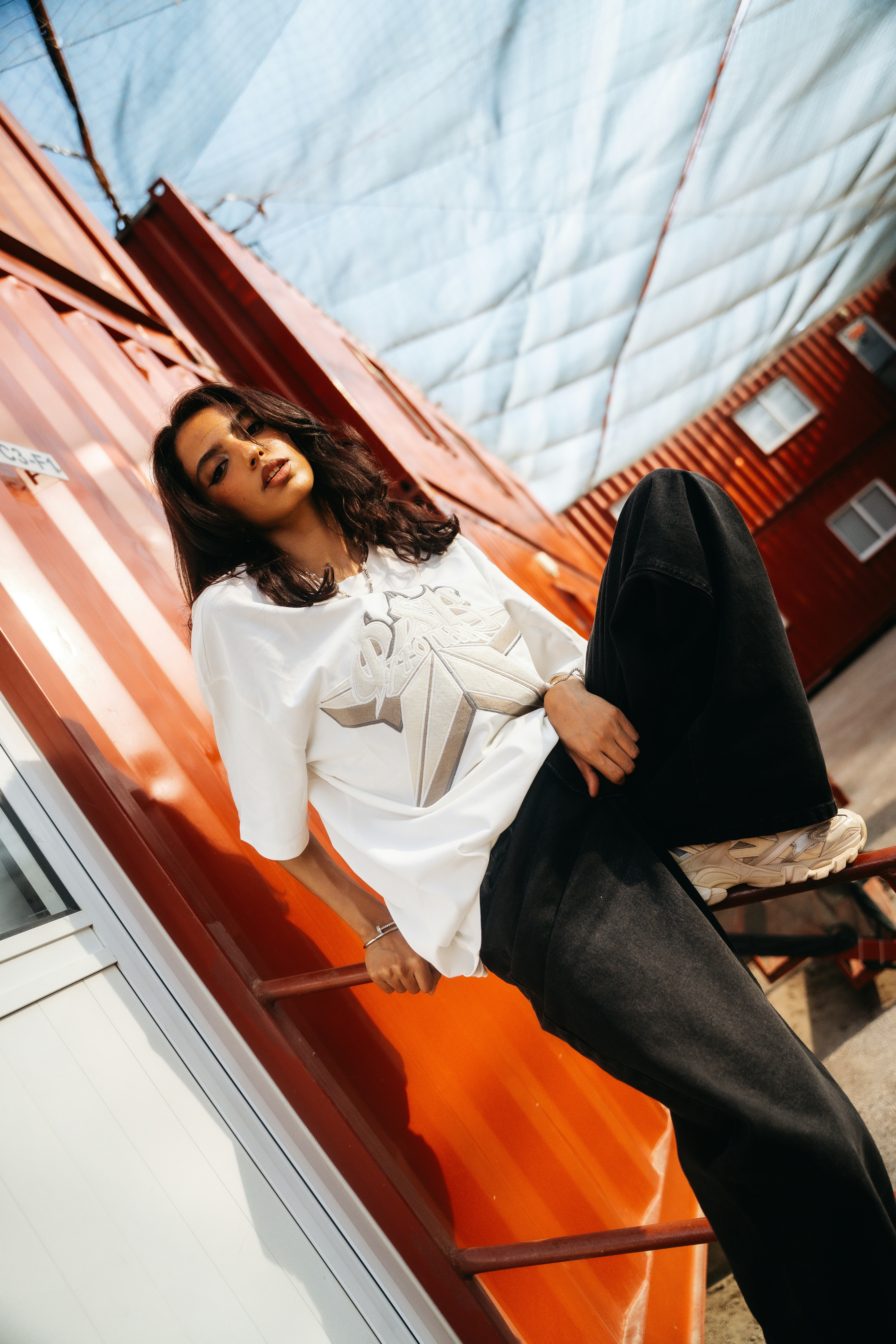 Leaned Pose, Colorful Backdrop: A City-Block Portrait