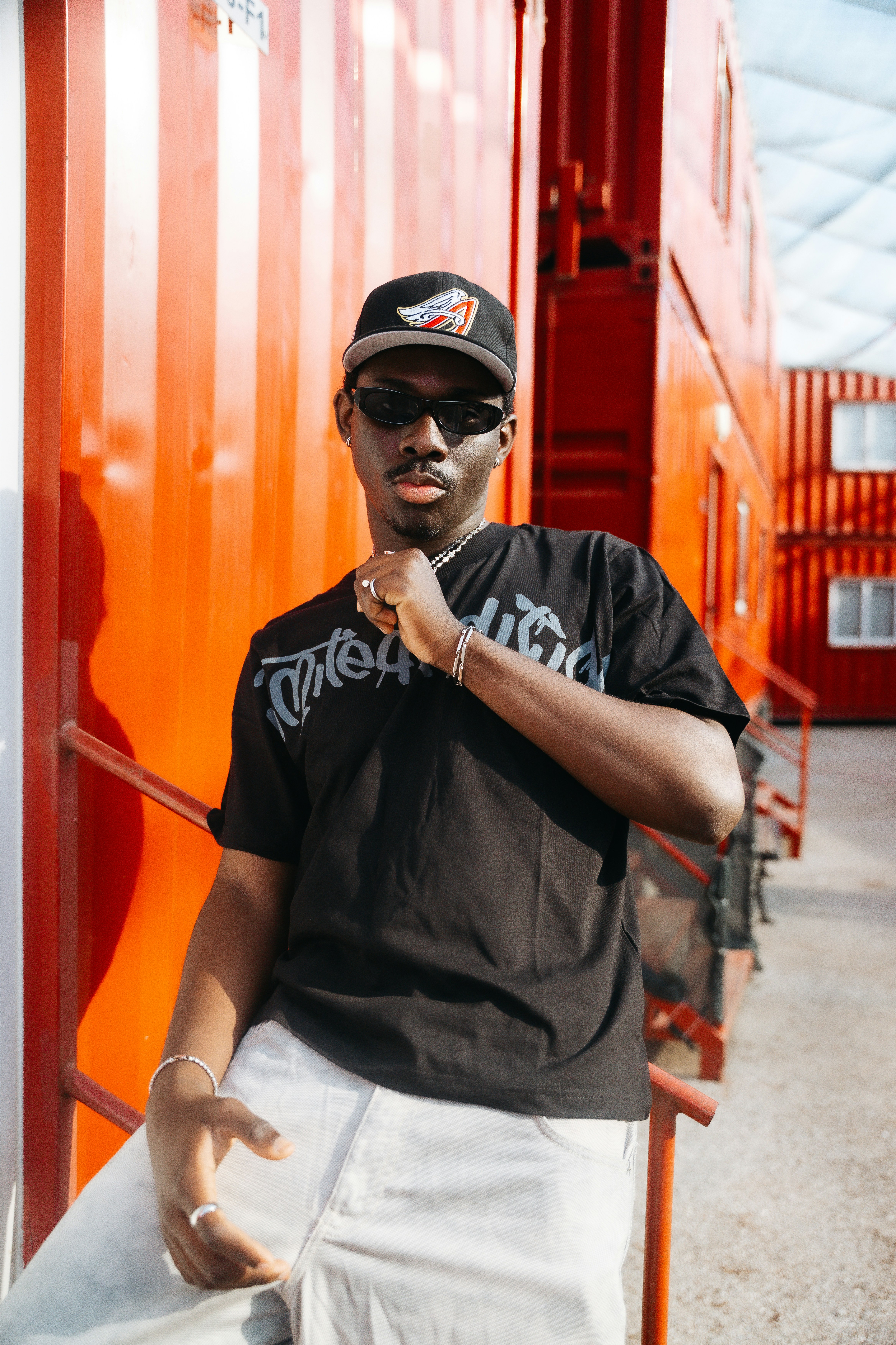Pose in Red Corridor: Streetwear Portrait with Bold Contrast