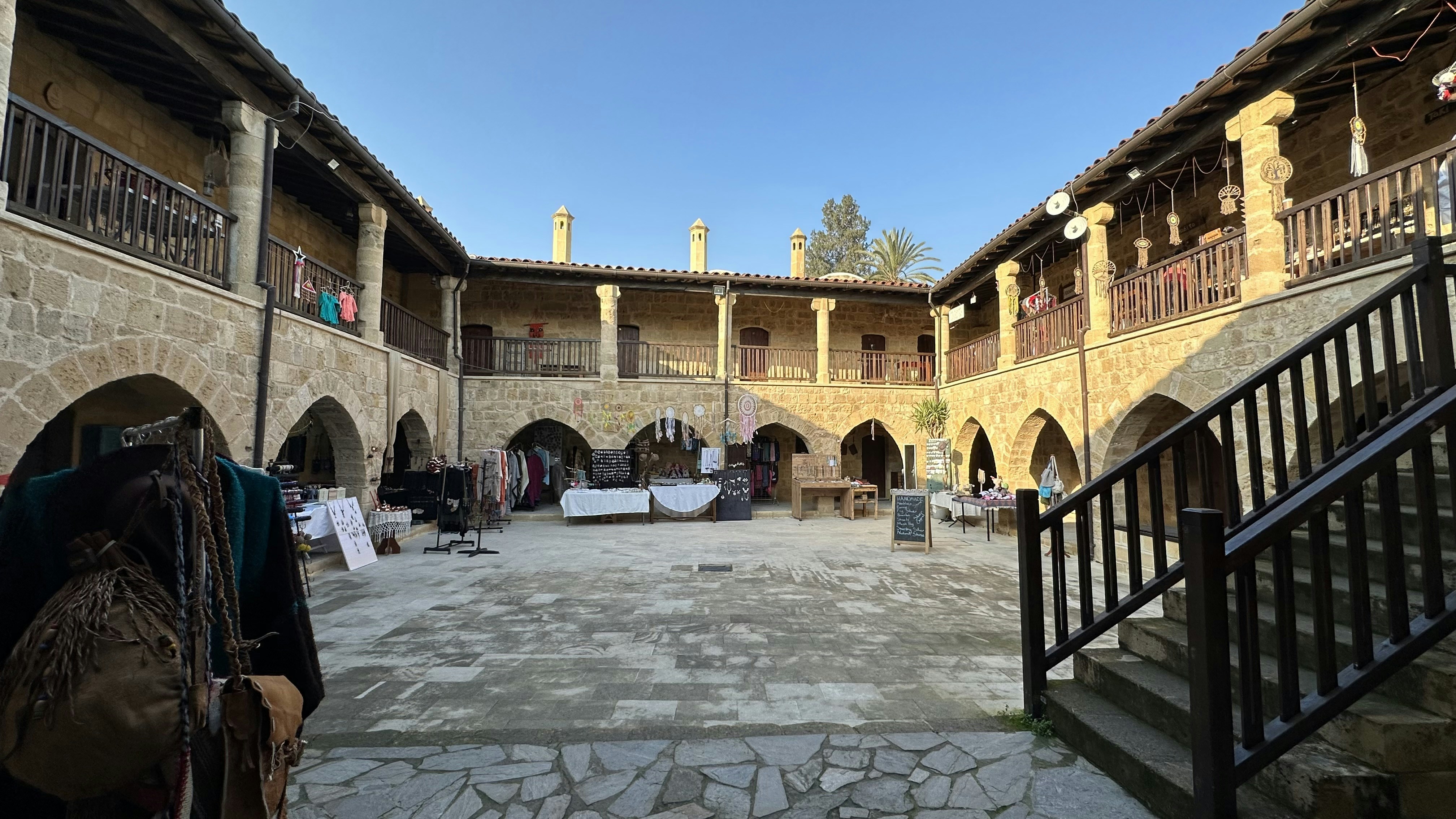 Cours in der Burghof: A Sunlit Central Courtyard with Archways and Stairs