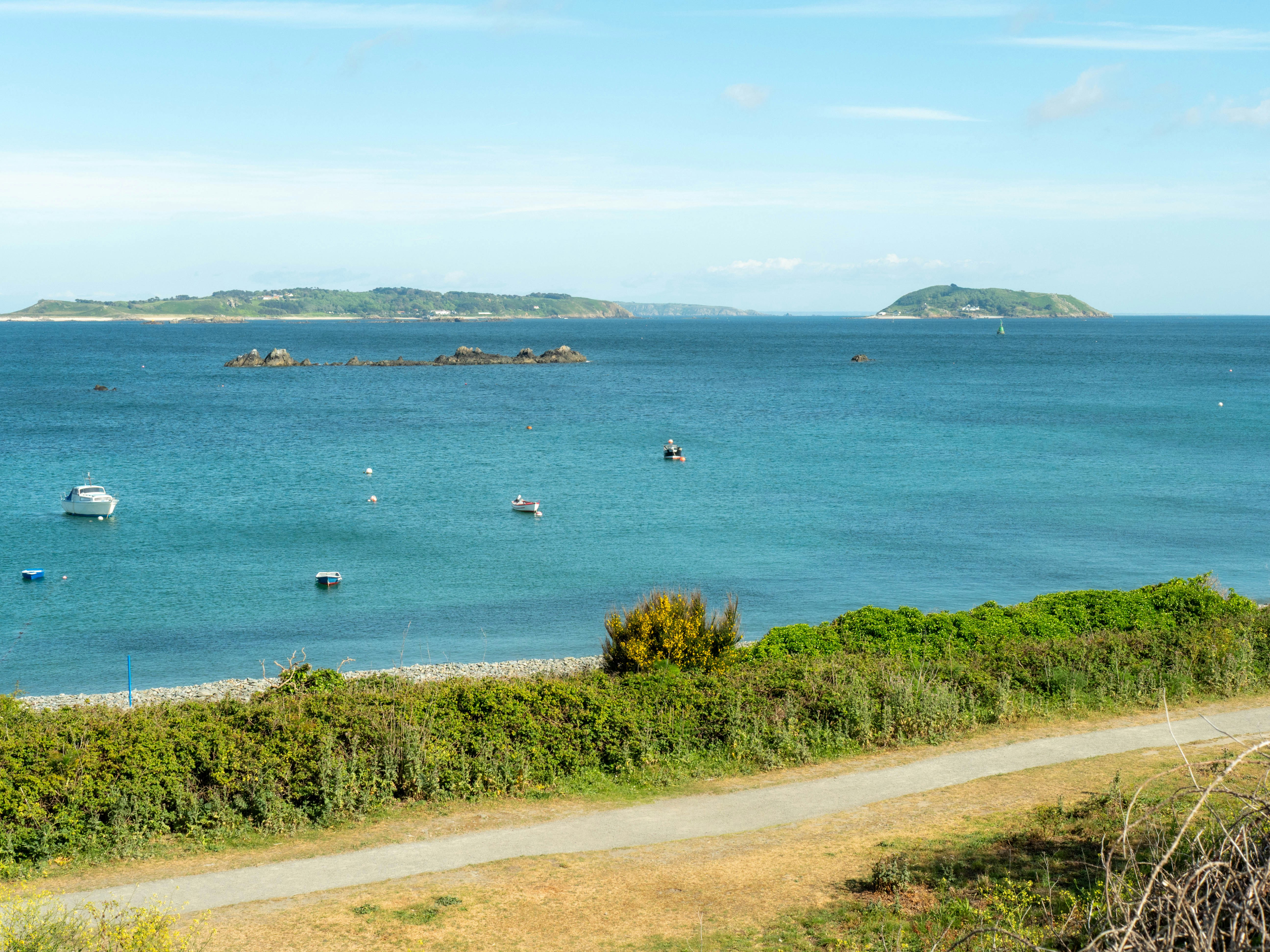 Coastal Horizon: Boats resting on a calm sea