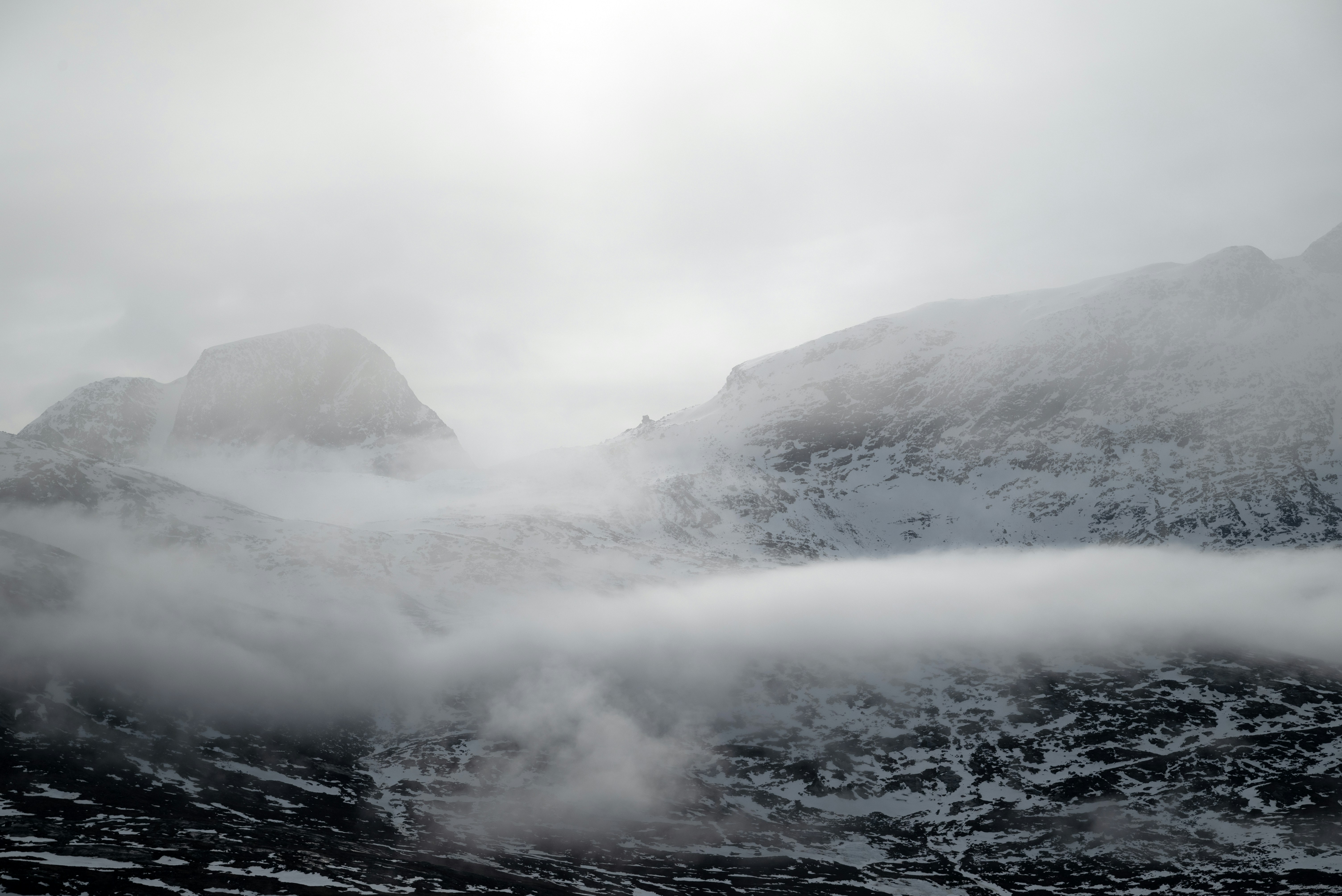 Mist-Softened Peaks Above an Ice-Blanketed Valley