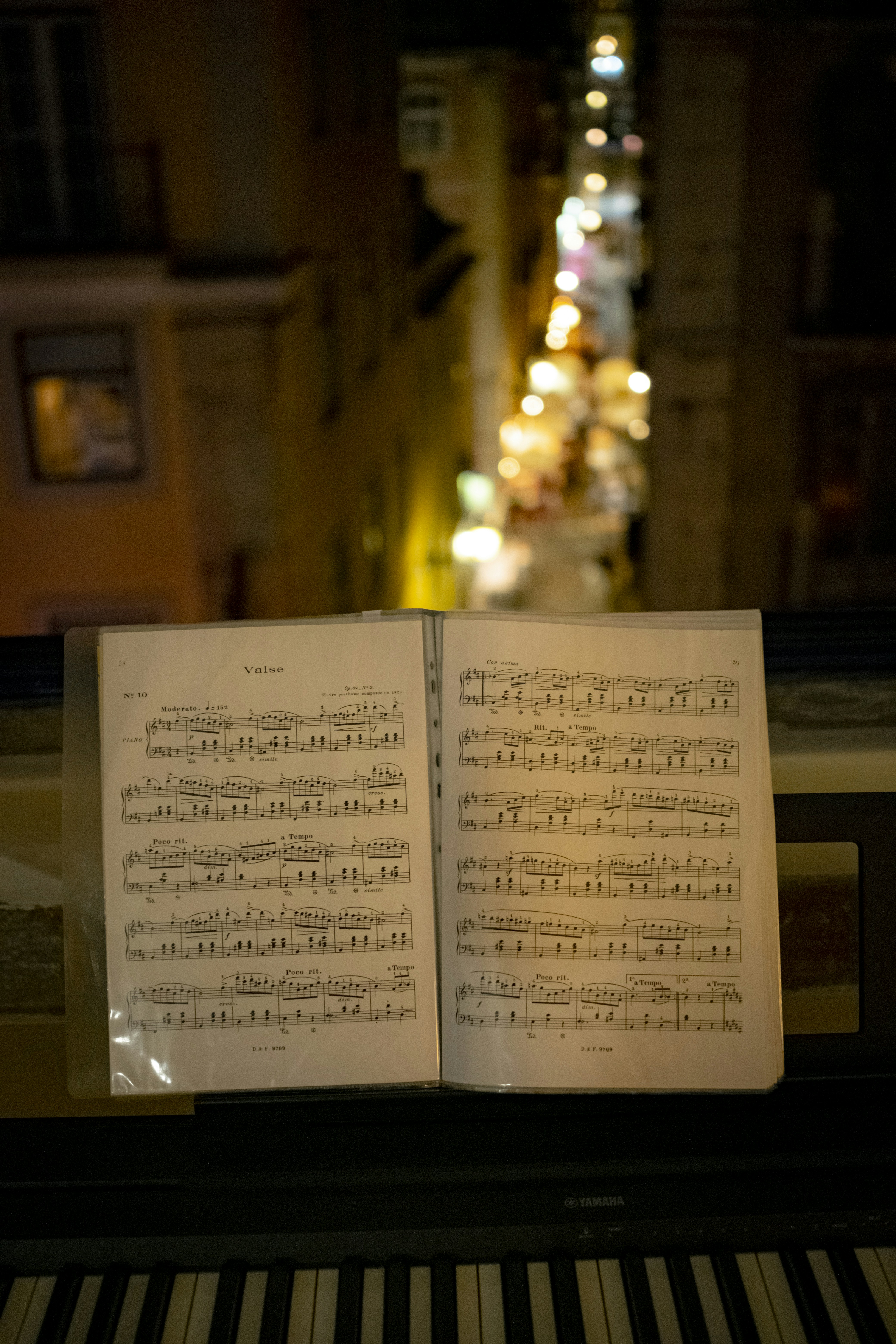 Moonlit Piano Stand: A Nighttime Score Open on the Street
