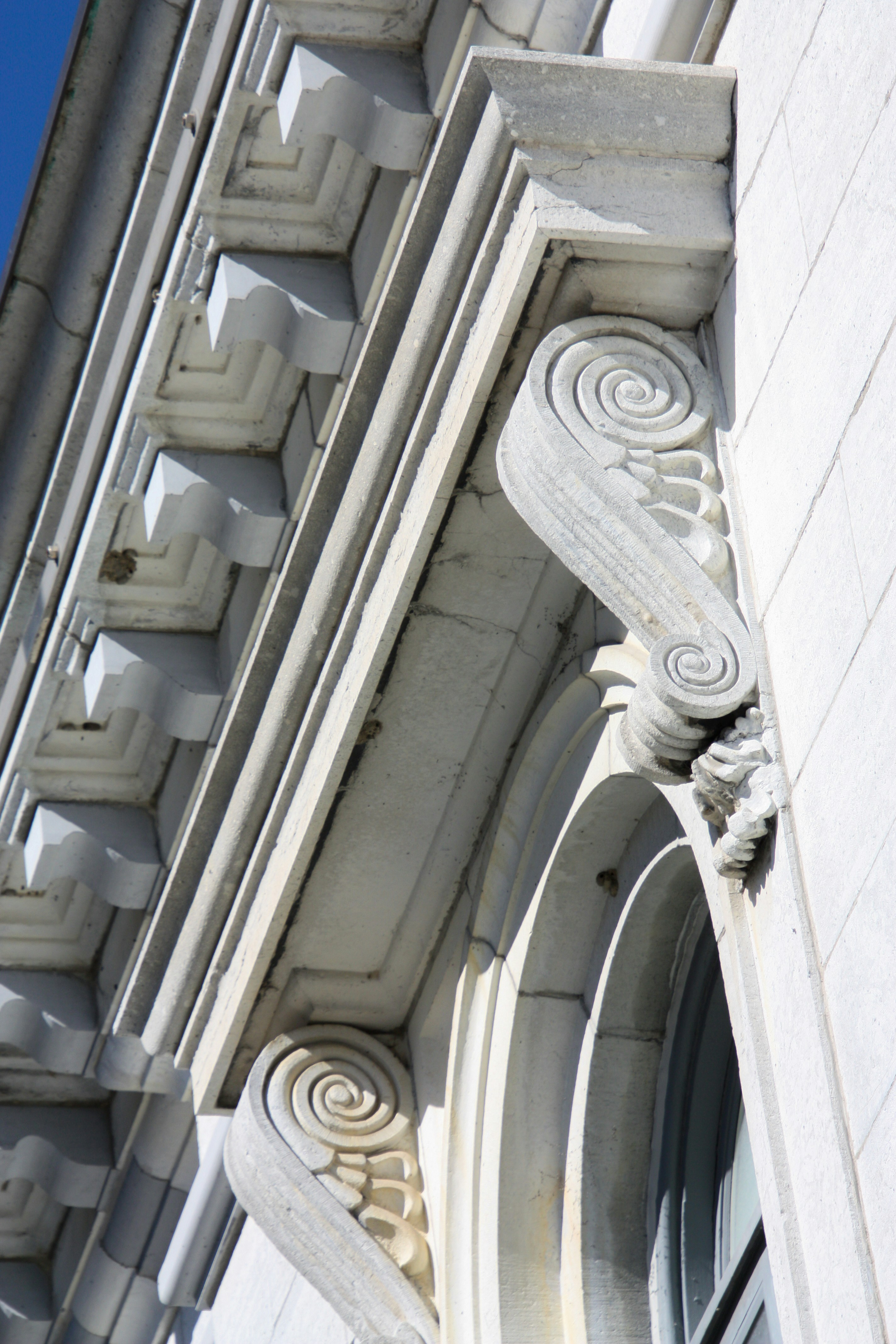 Architectural Cadence: Spiral Ornament Framing a Stone Arch