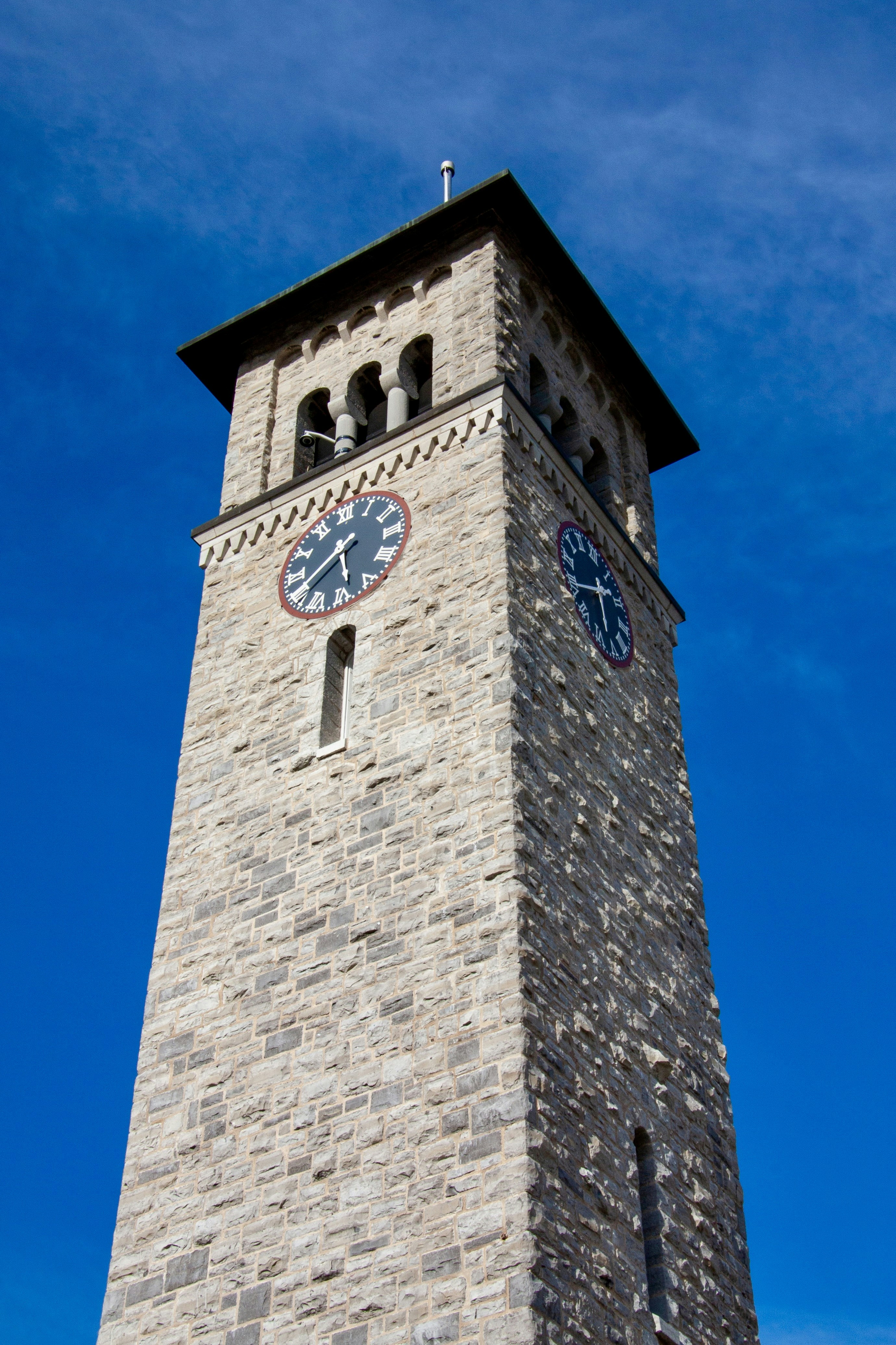 Stone Clocktower Reaching Toward a Clear Sky