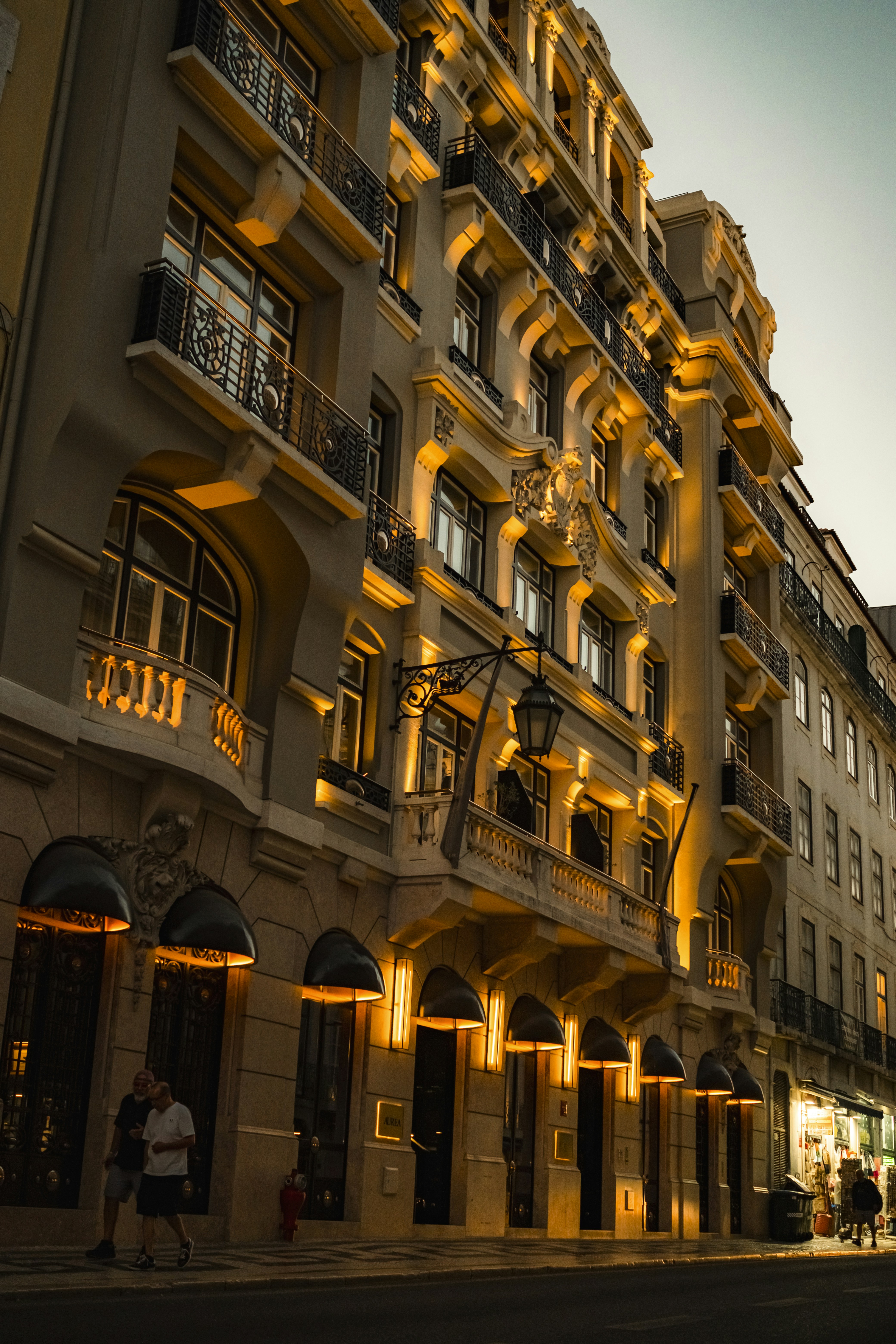 Golden Hour Facades: Cantilevered Lights on a Parisian-Style Street