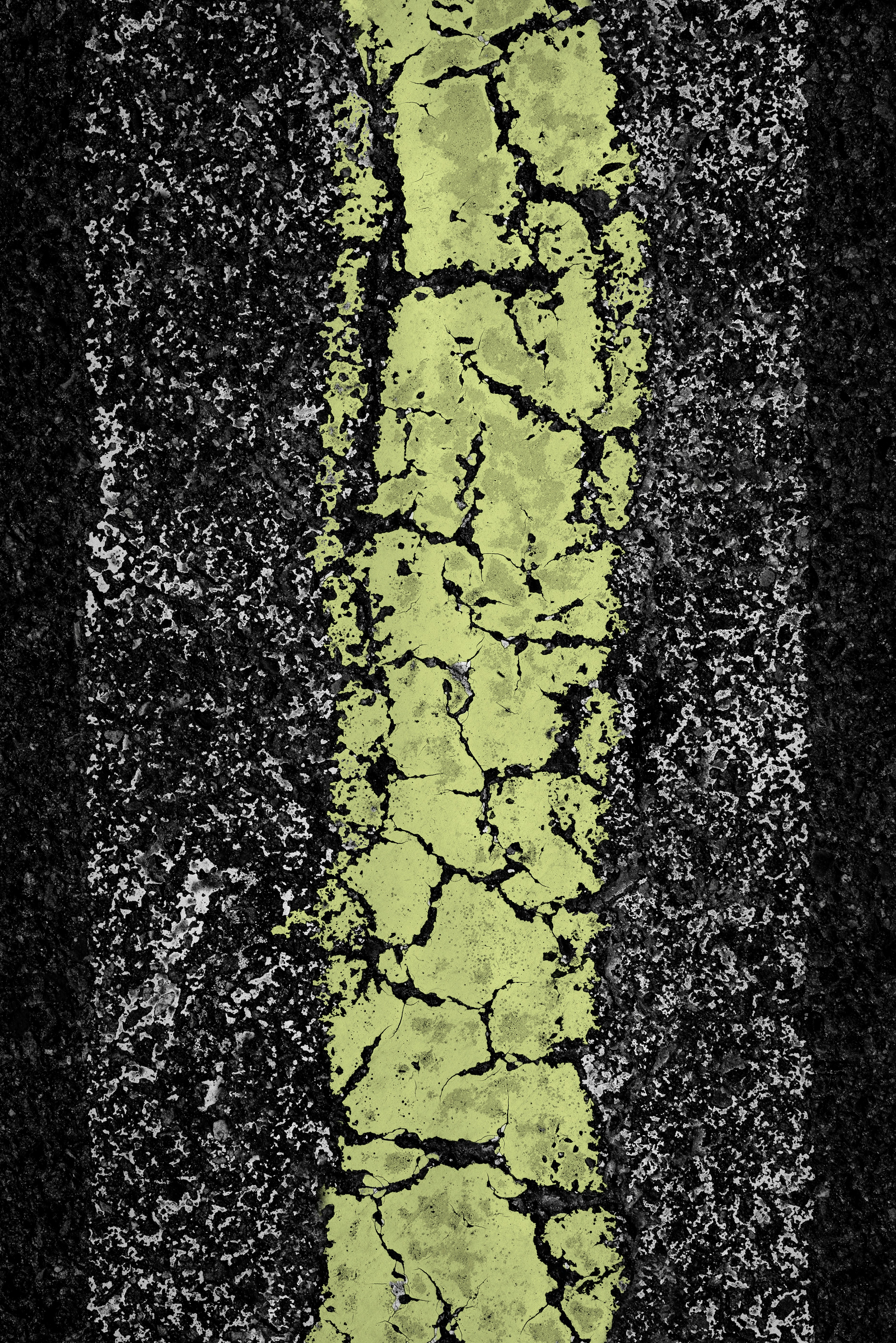 Cracked Yellow Stripe on Asphalt