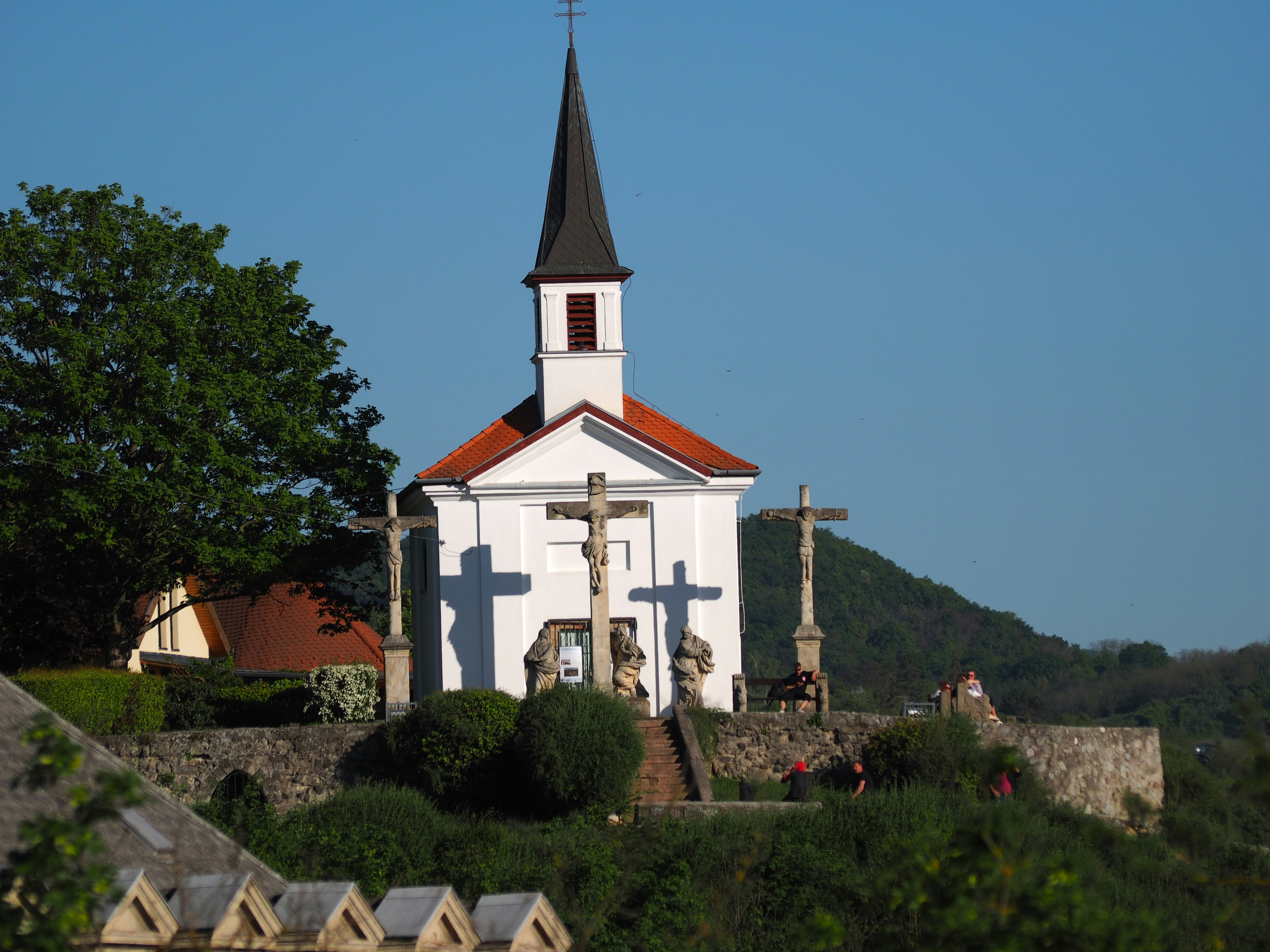 Hilltop Chapel under a Clear Blue Sky