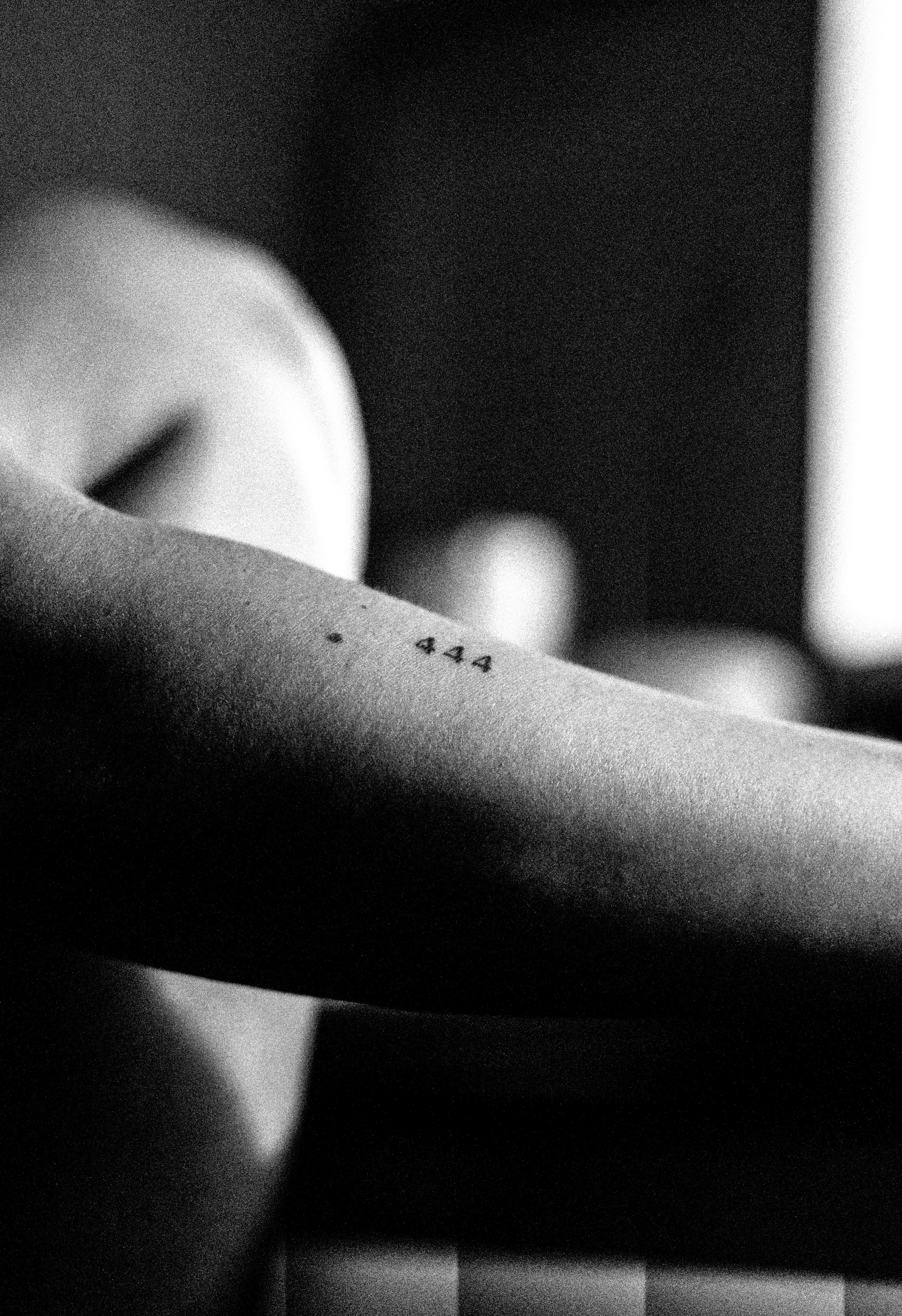 Ink of Identity: A Minimal Tattoo on a Bare Arm
