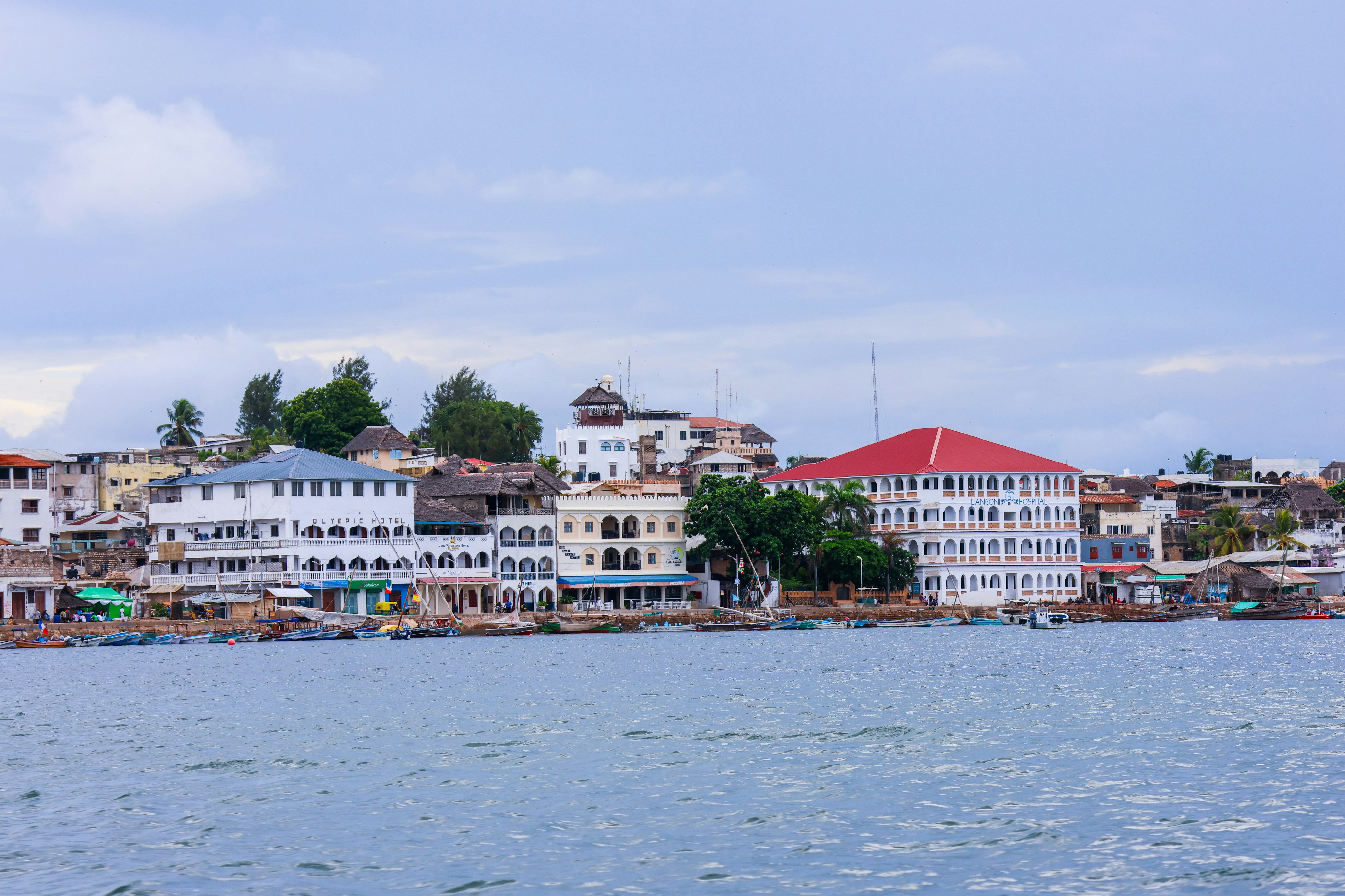 Harborfront Facades: A Quiet Seaside Row of Whitewashed Buildings