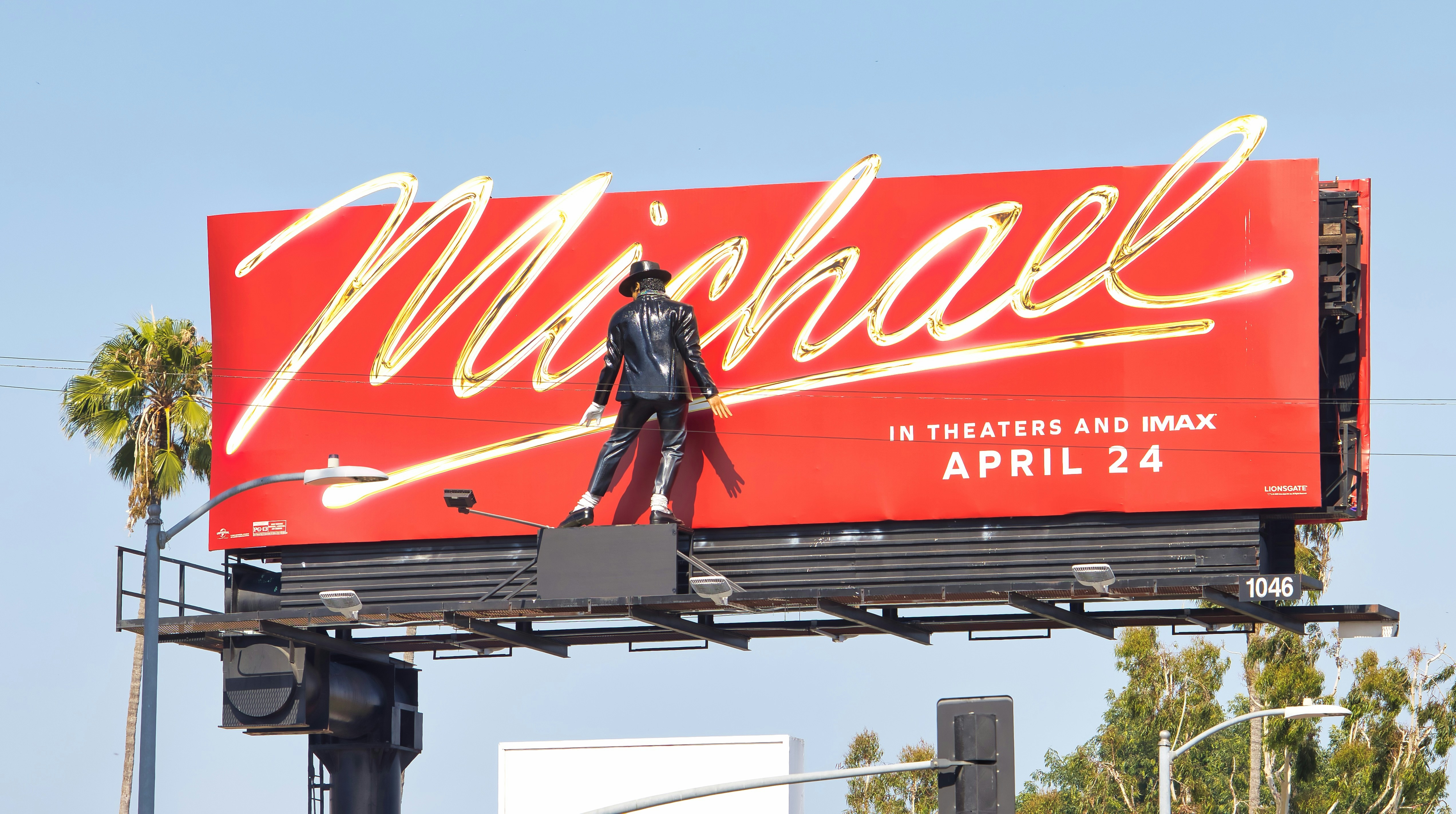 Michael Keeps His Balance: A Human Silhouette Claimed by a Neon-Mcript Billboard