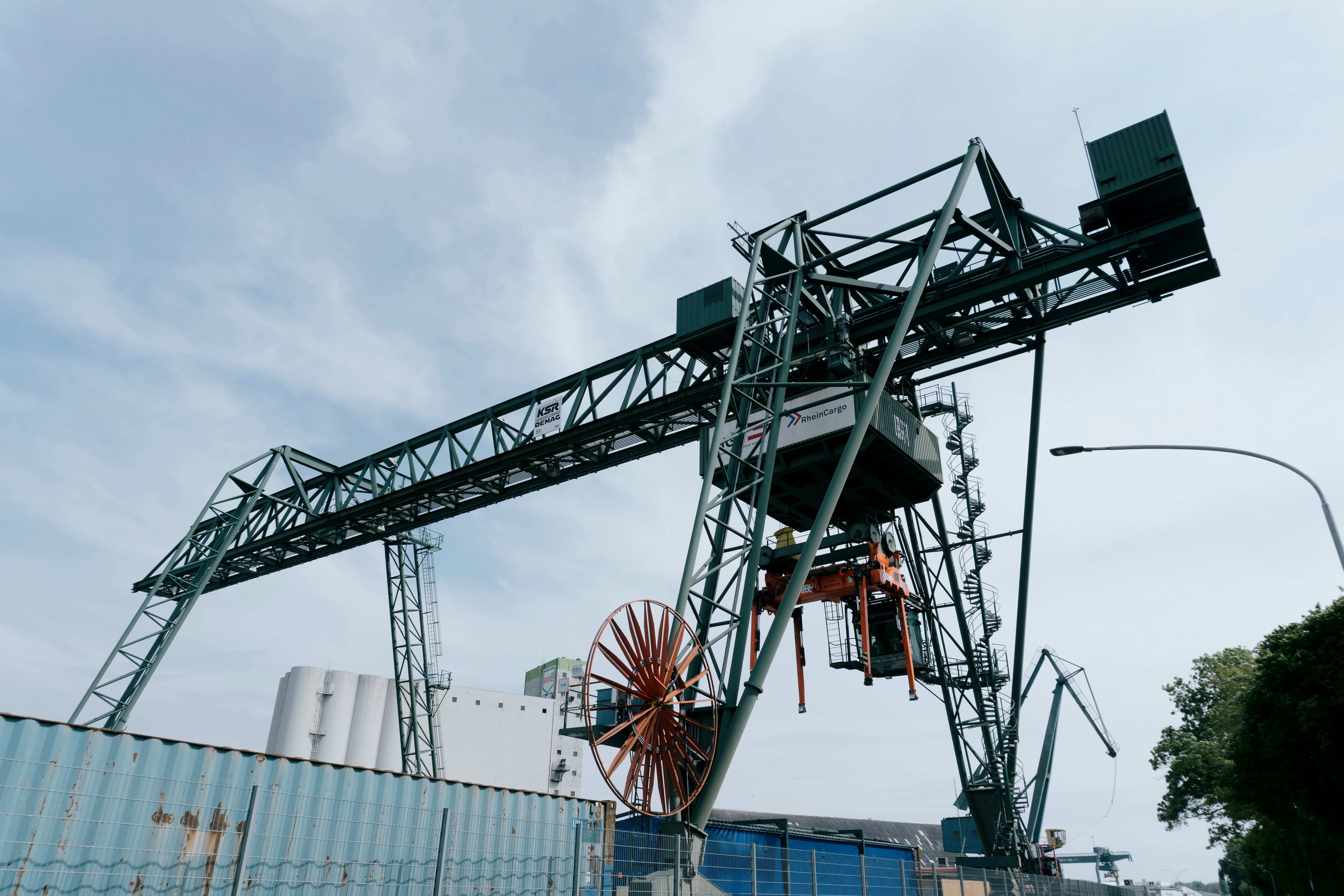 Industrial Crane in Motion: A Quiet Moment Under a Bright Sky