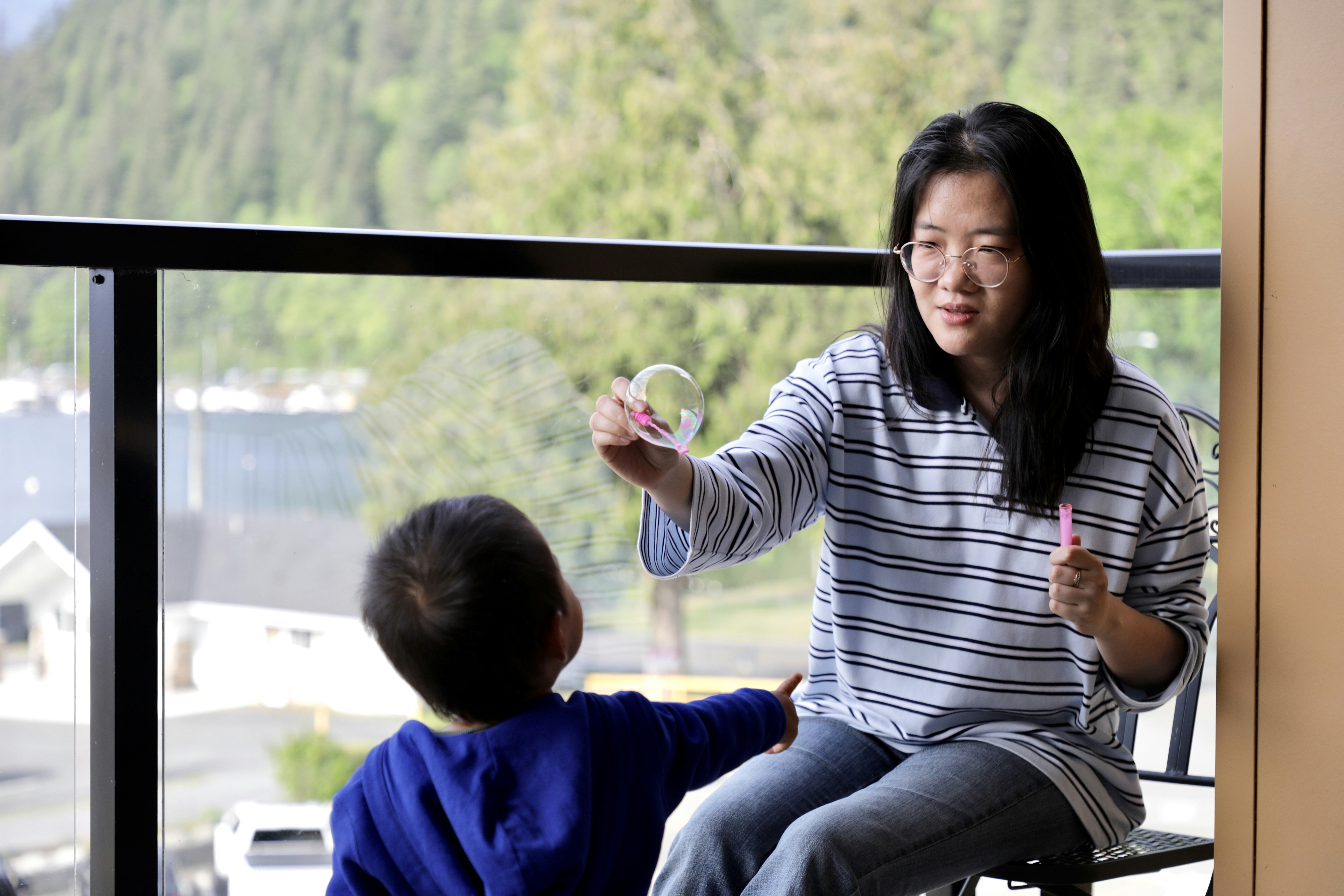 Bubble Play on a Balcony: A Softer Moment of Discovery