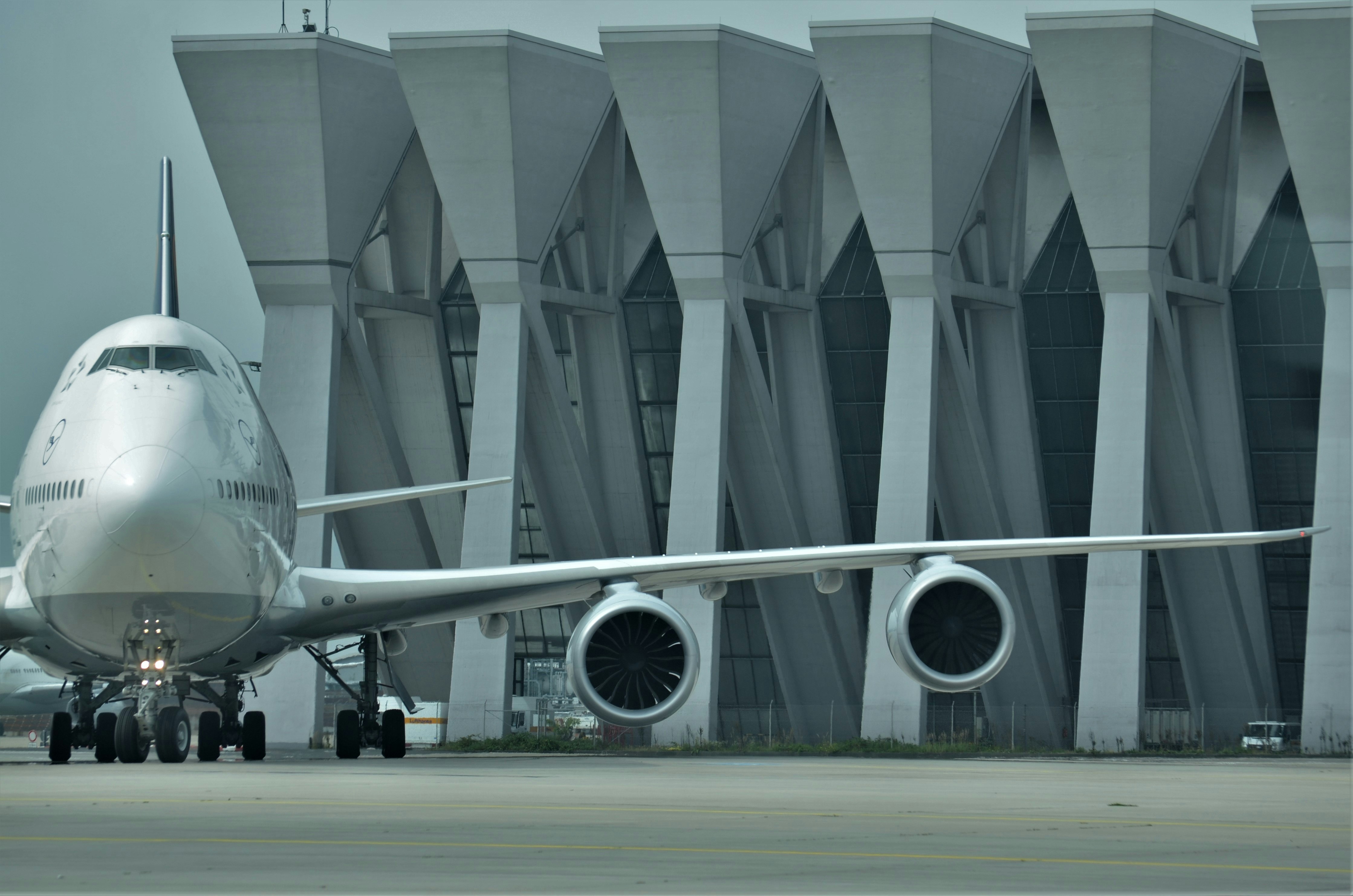 Front View of a Jet at a Modern Hangar