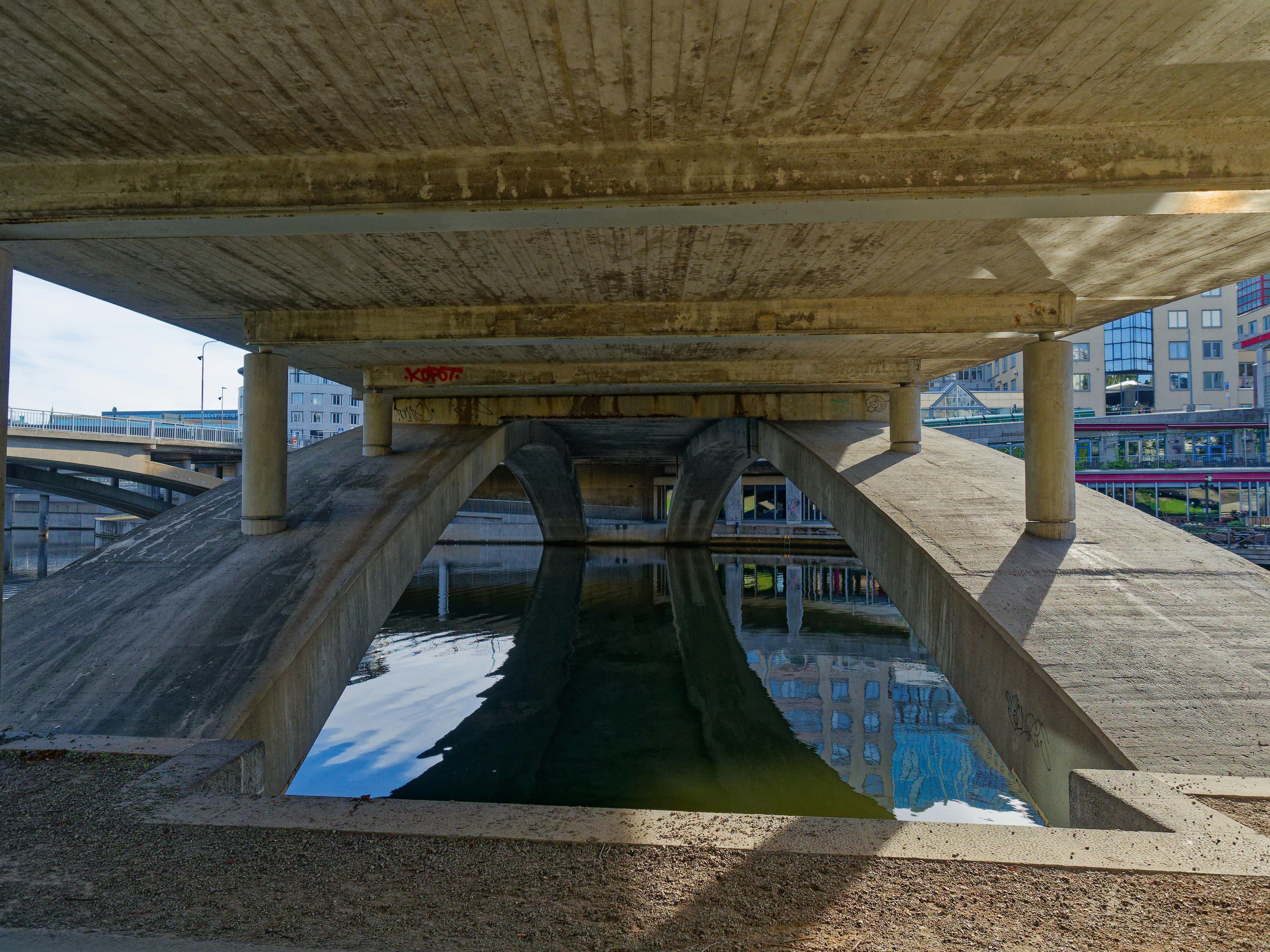 Underneath the Bridge: Symmetry and Reflections in Concrete