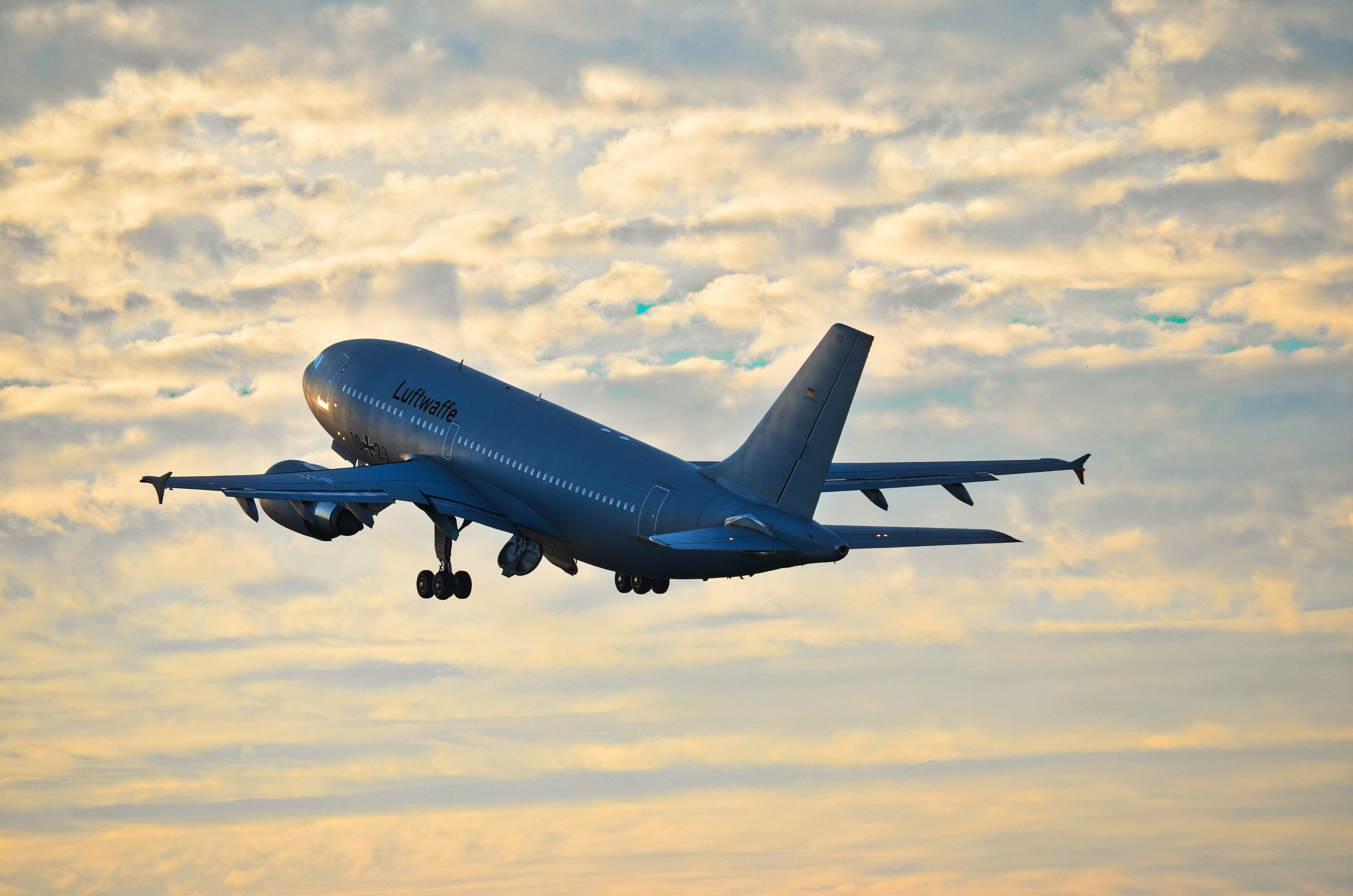 Lone Livery in Transition: A Jet Climbing Through Dusk