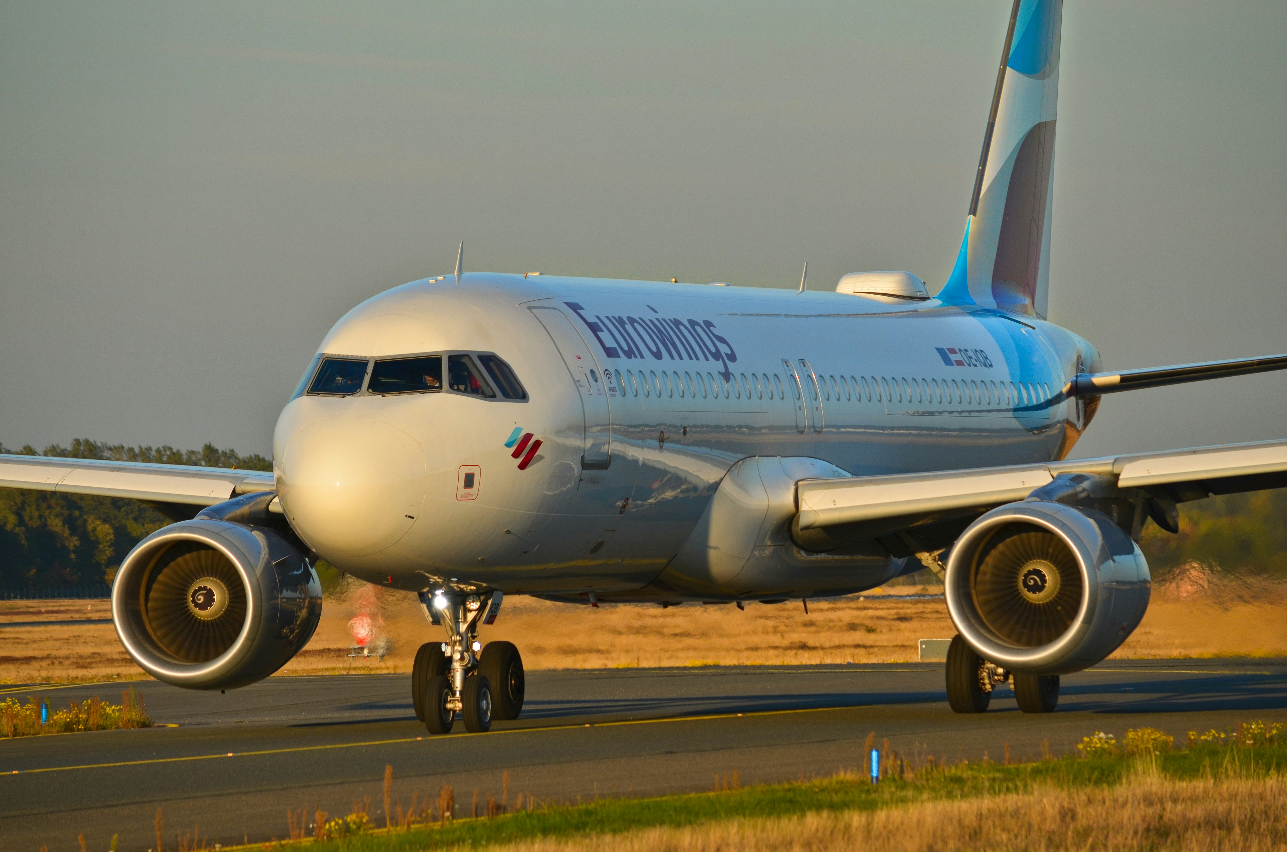Lone airliner on a sunlit runway