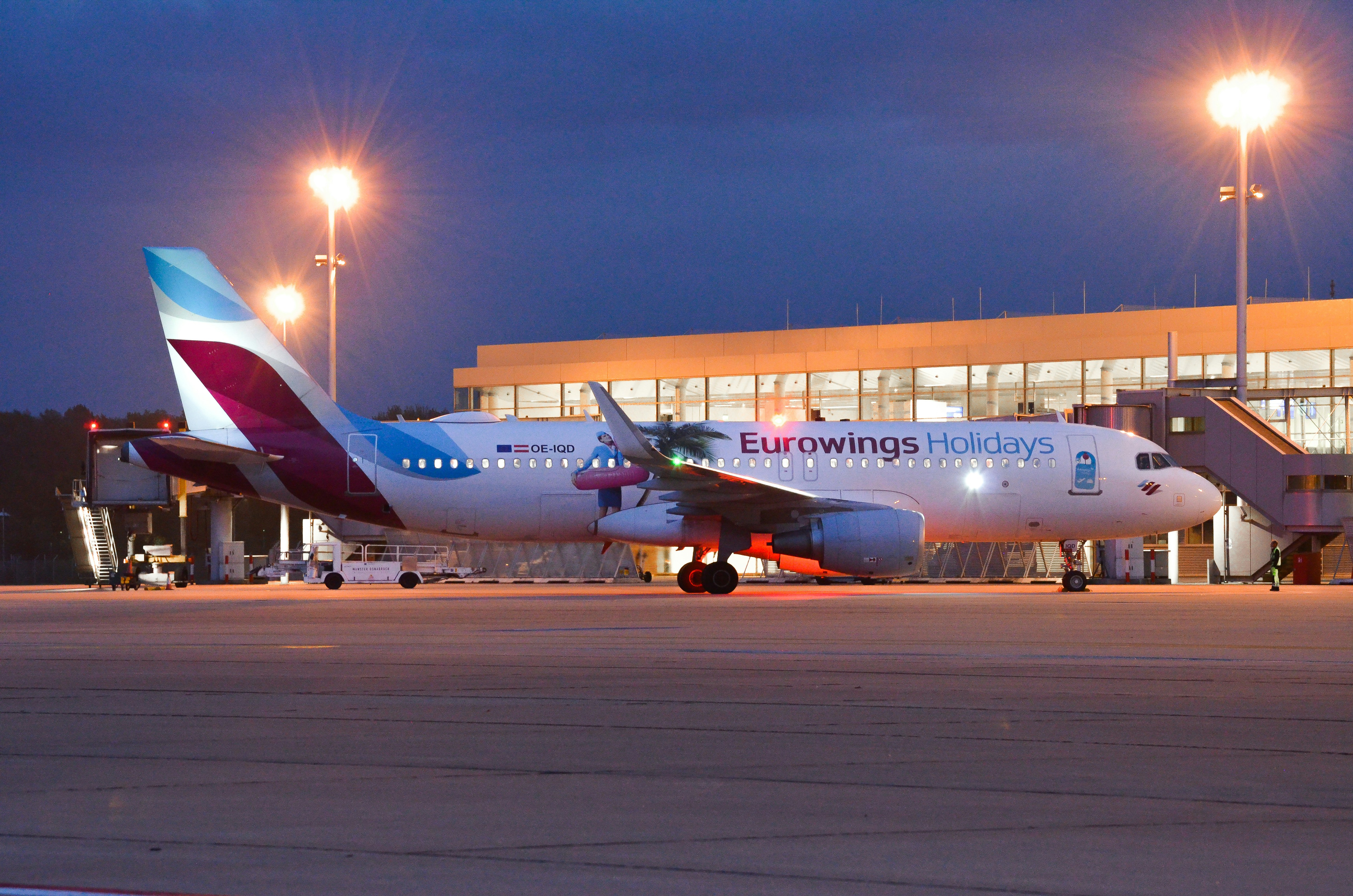 Eurowings Holidays Jet at Night: Quiet Tarmac Under Floodlit Runway