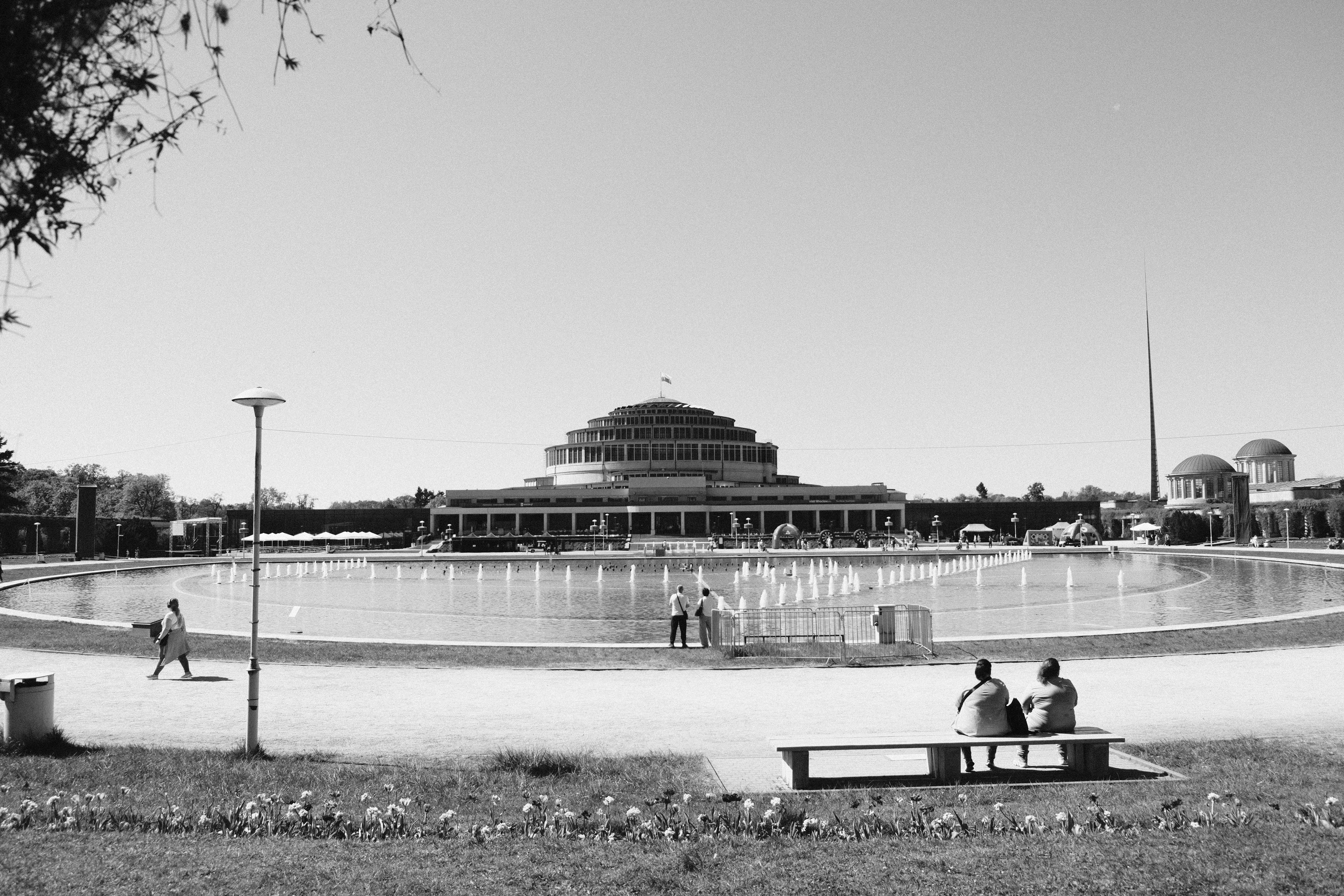 Symmetrical Plaza: A Circular Fountain and Riverside Pavilion