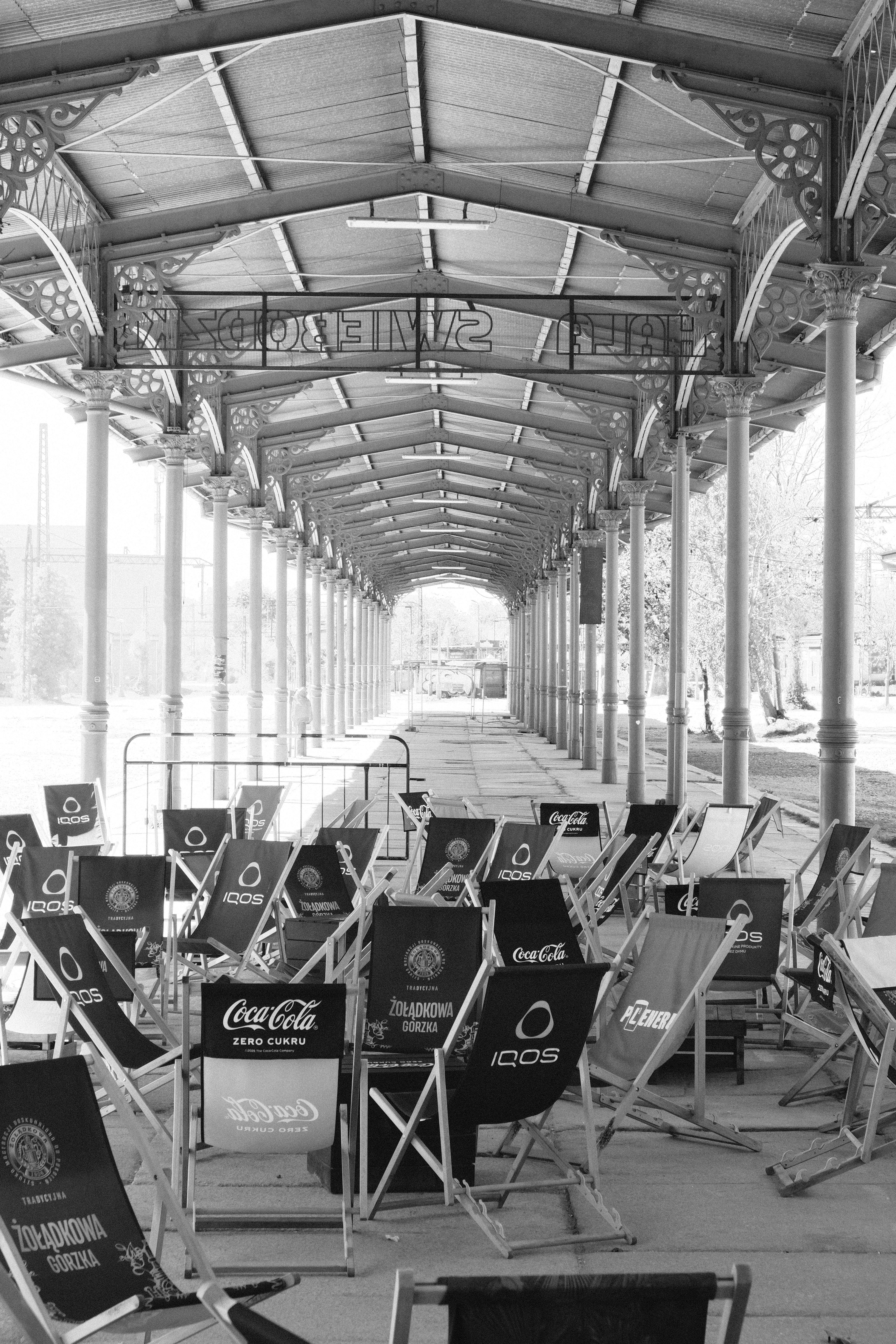 Sheltered Seating: An Empty Promenade of Shaded Rails