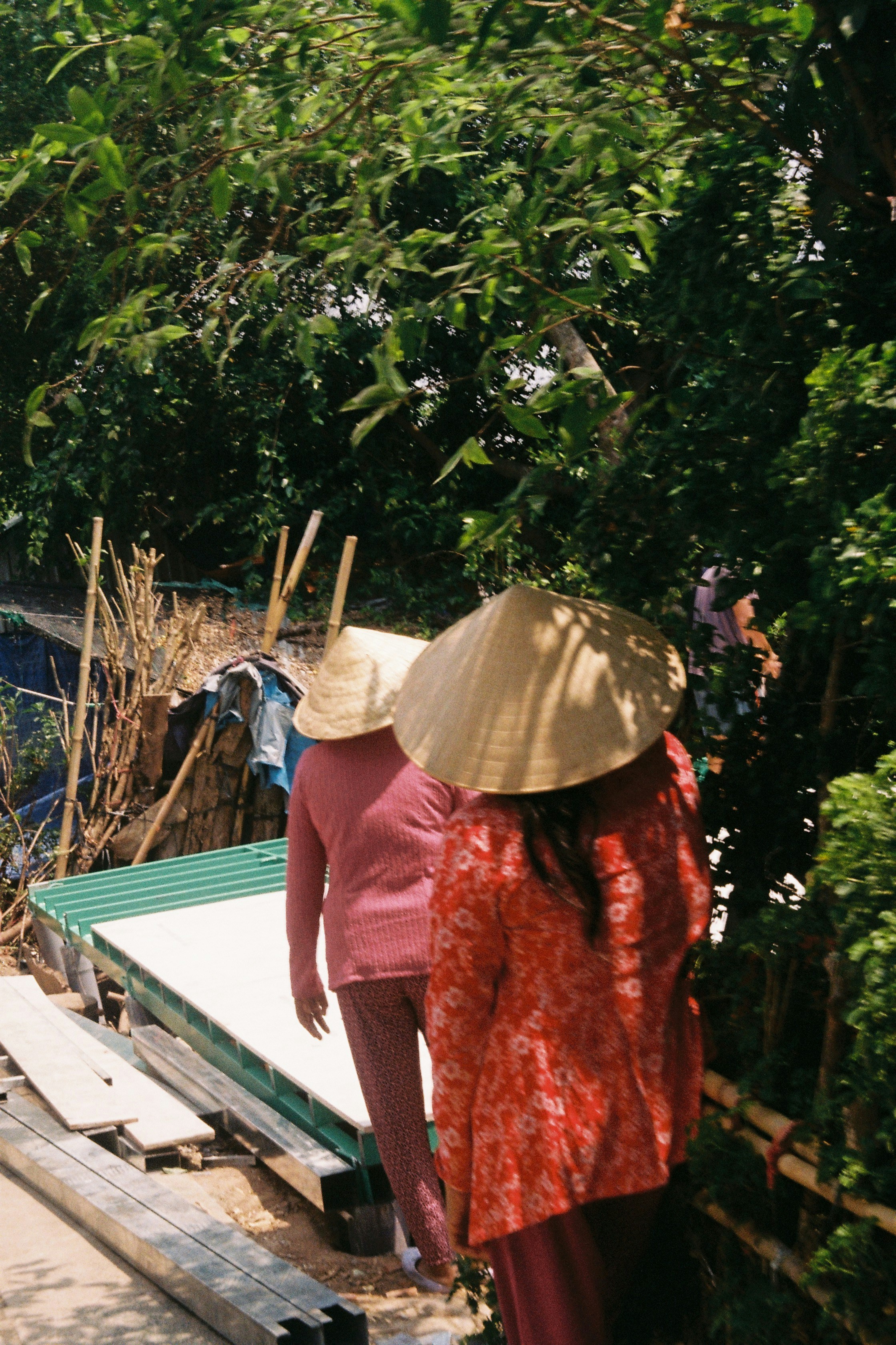 Sunlit Straw Hats and Quiet Path in the Garden