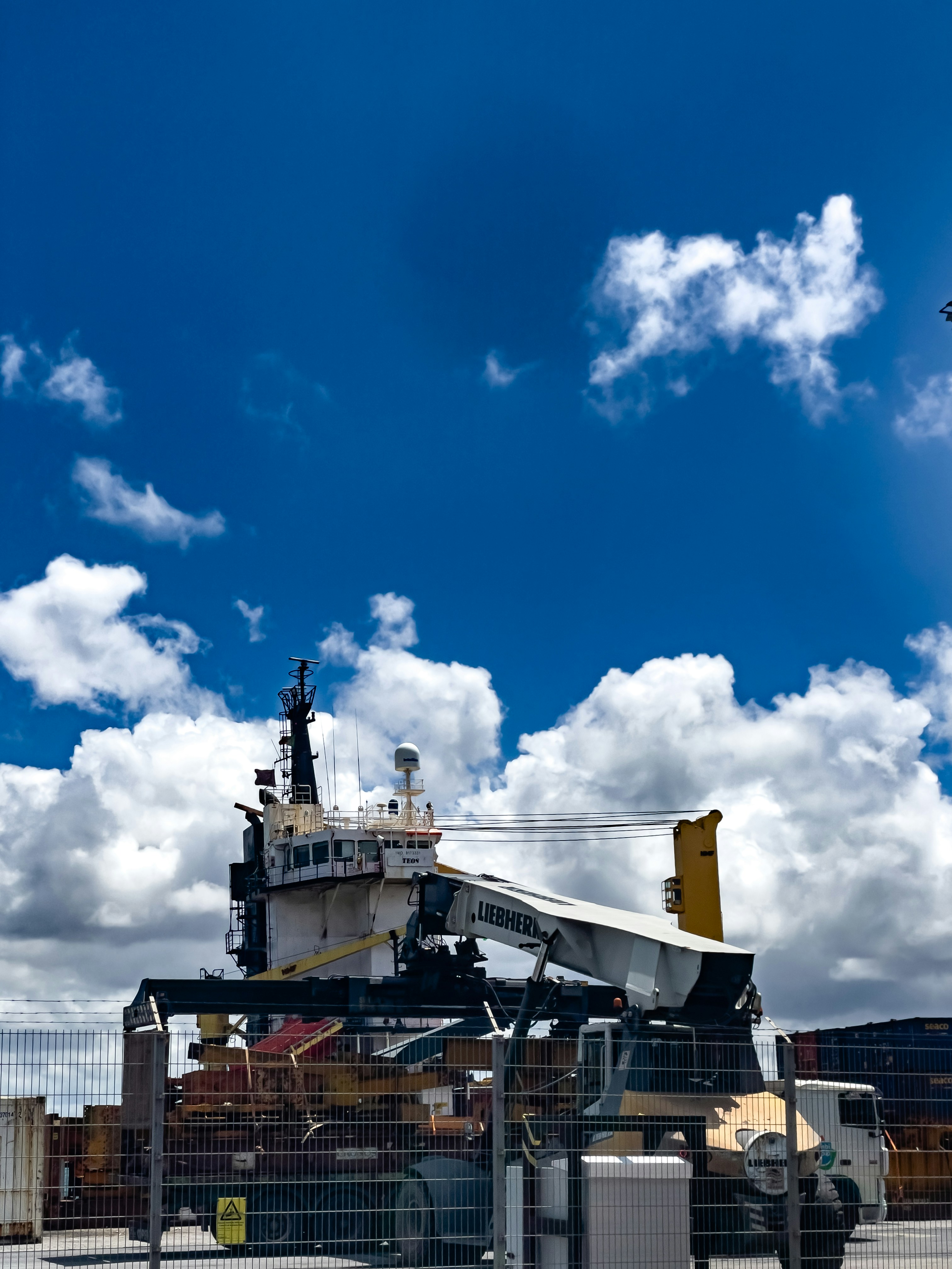 Harbor Giant: A Dockside Crane Reaches Toward the Sky